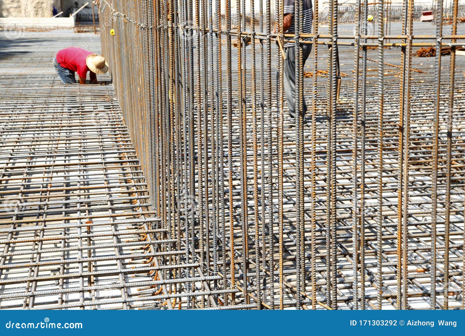 Worker in the Construction Site Making Reinforcement Metal Framework ...