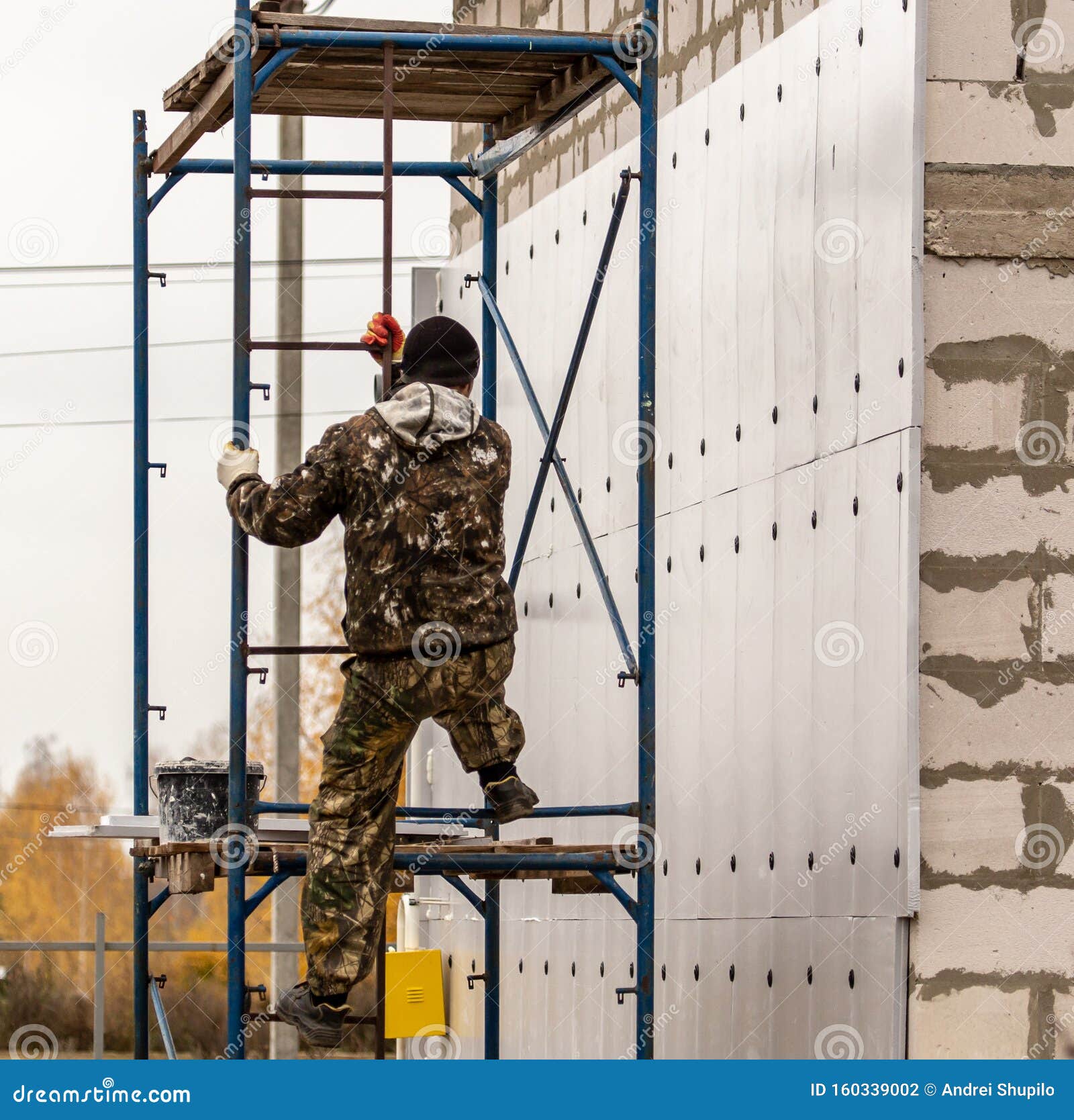 Worker on the Construction of Wall Insulation in the House Stock Photo ...