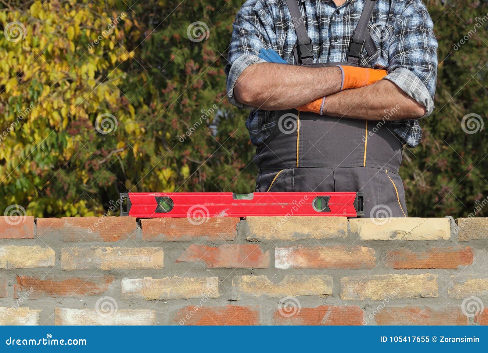 Worker Examining Brick Wall Stock Image - Image of equipment, craftsman ...