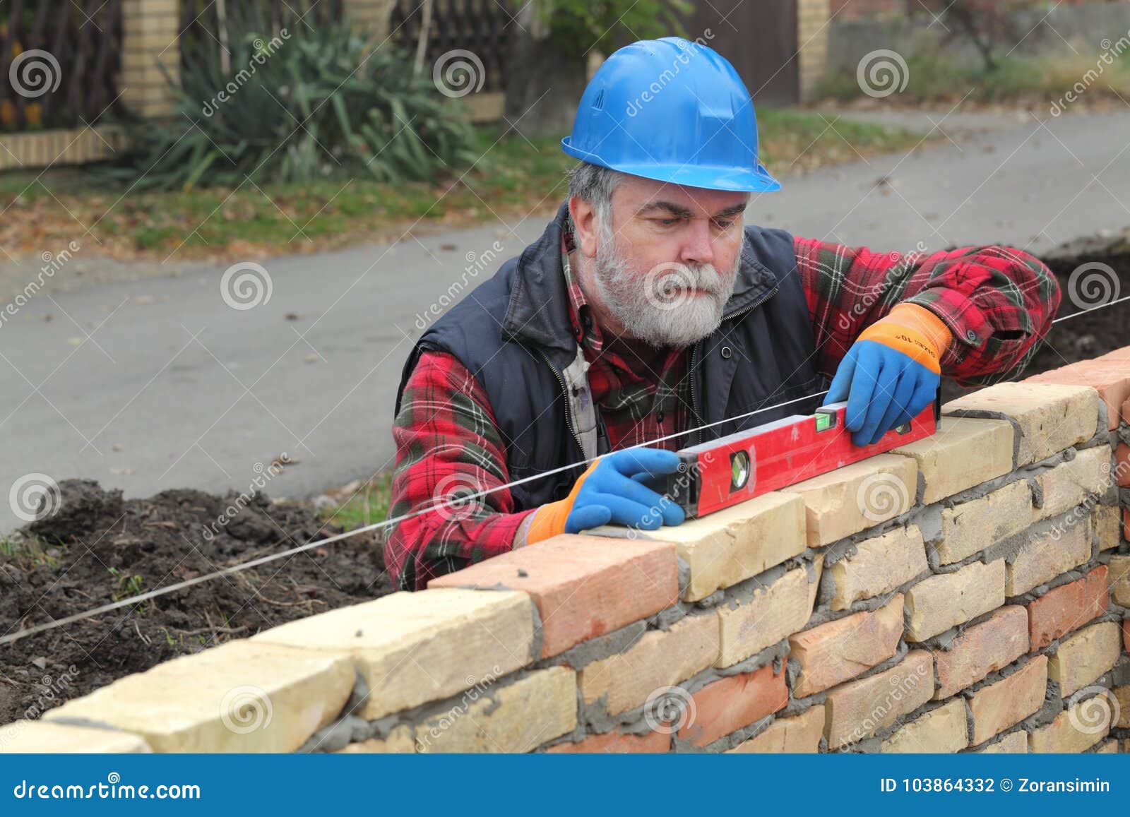 Worker Examining Brick Wall Stock Photo - Image of equipment, home ...