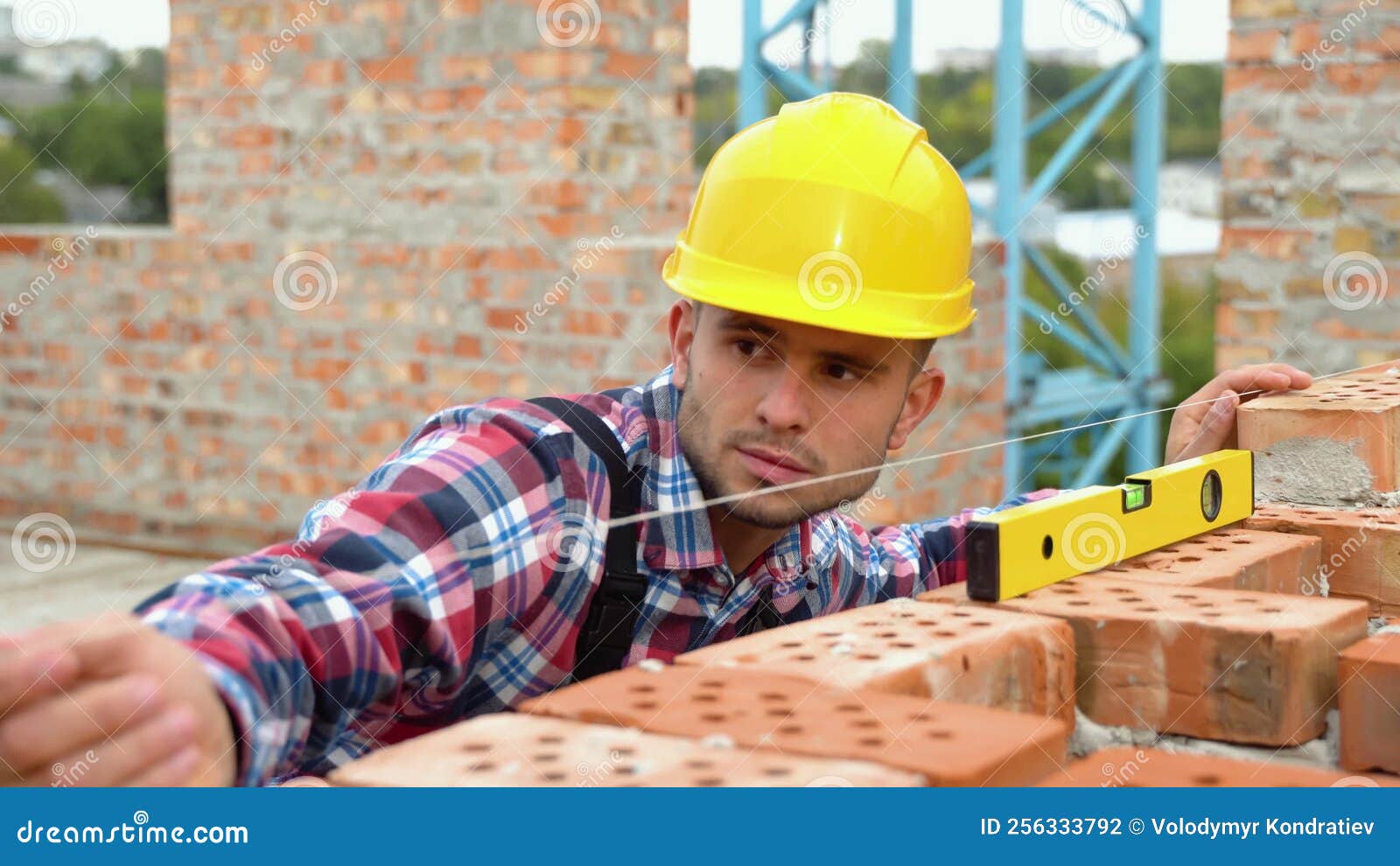 Worker Control Brick Wall Using Level Tool. Real Estate Project with ...