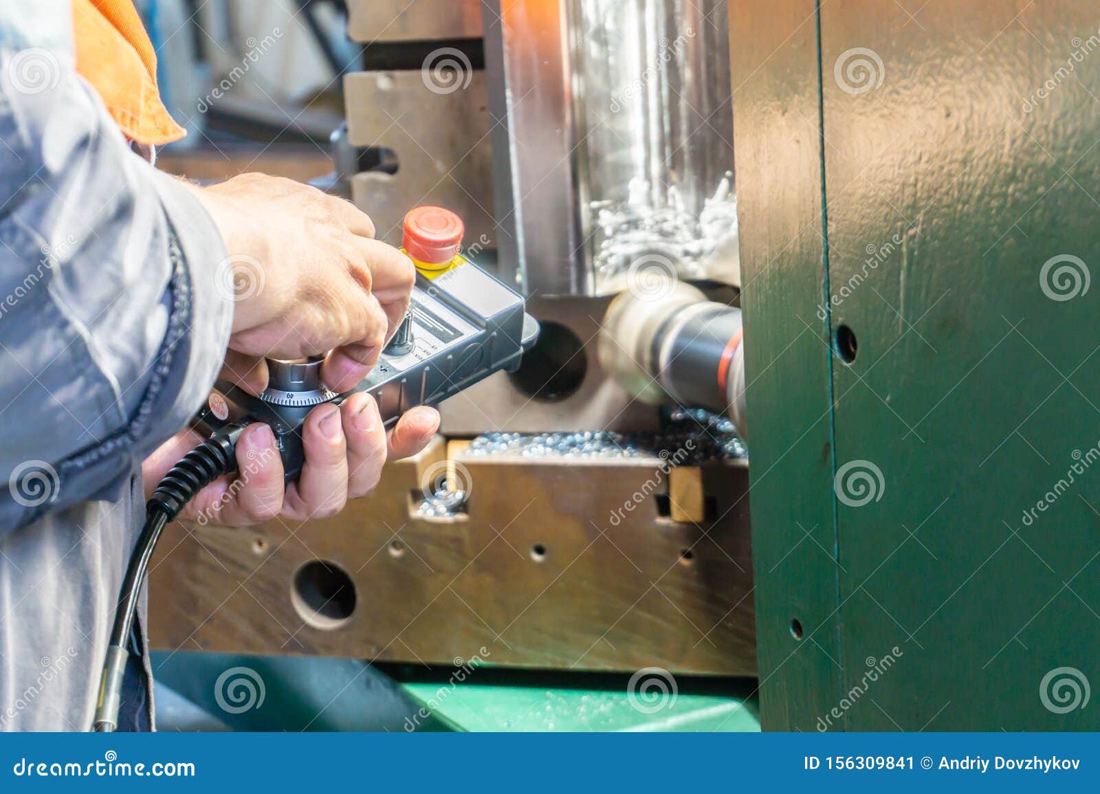 The Worker Controls the Remote Control on a Cnc Machine for Milling and ...