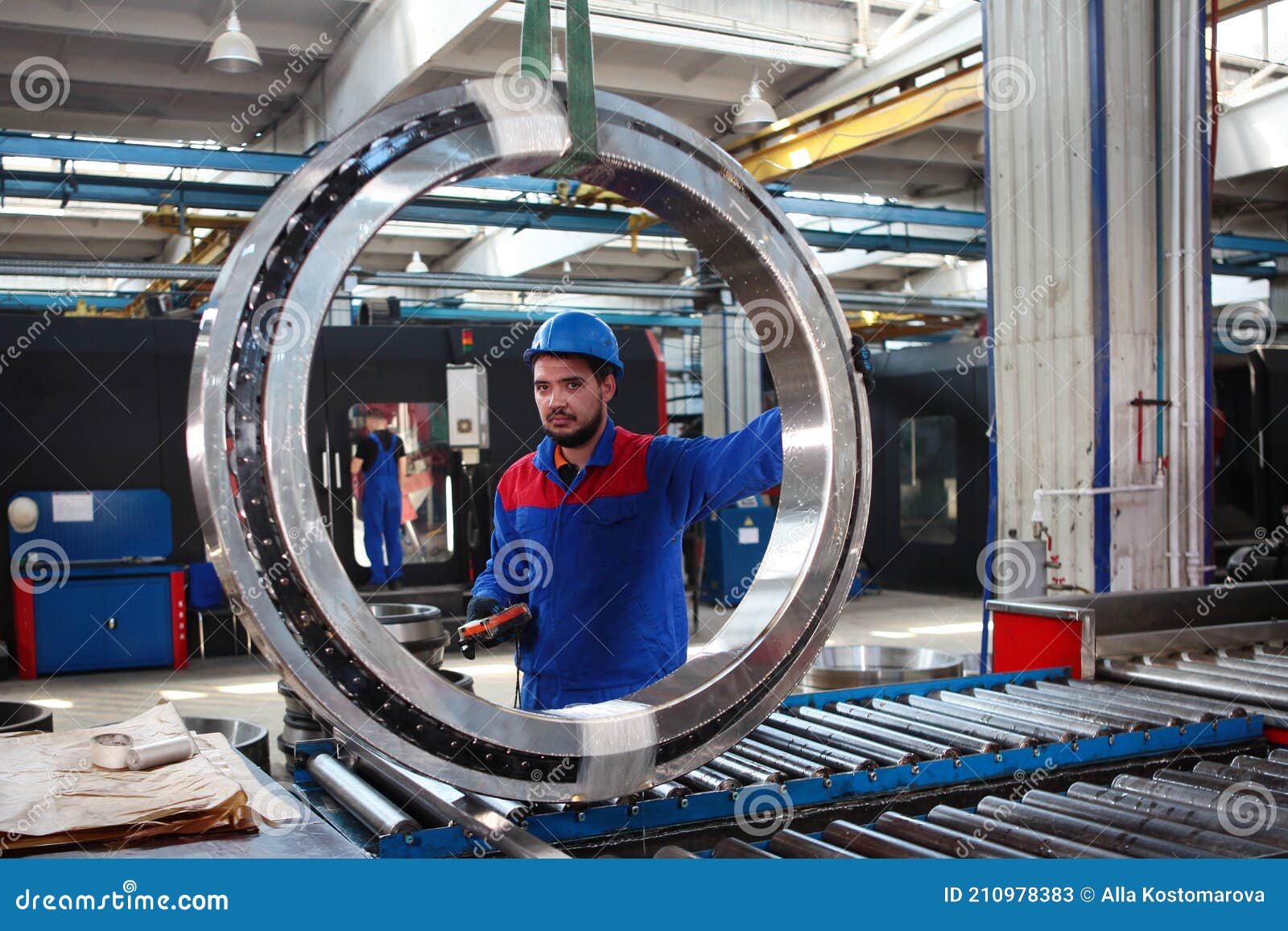 The Worker Controls the Transport of the Large Diameter Bearing. the ...