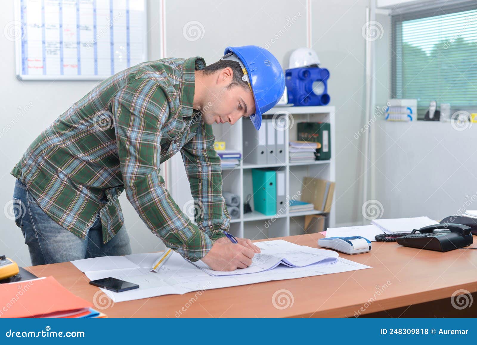 Worker correcting sketches stock photo. Image of ruler - 248309818