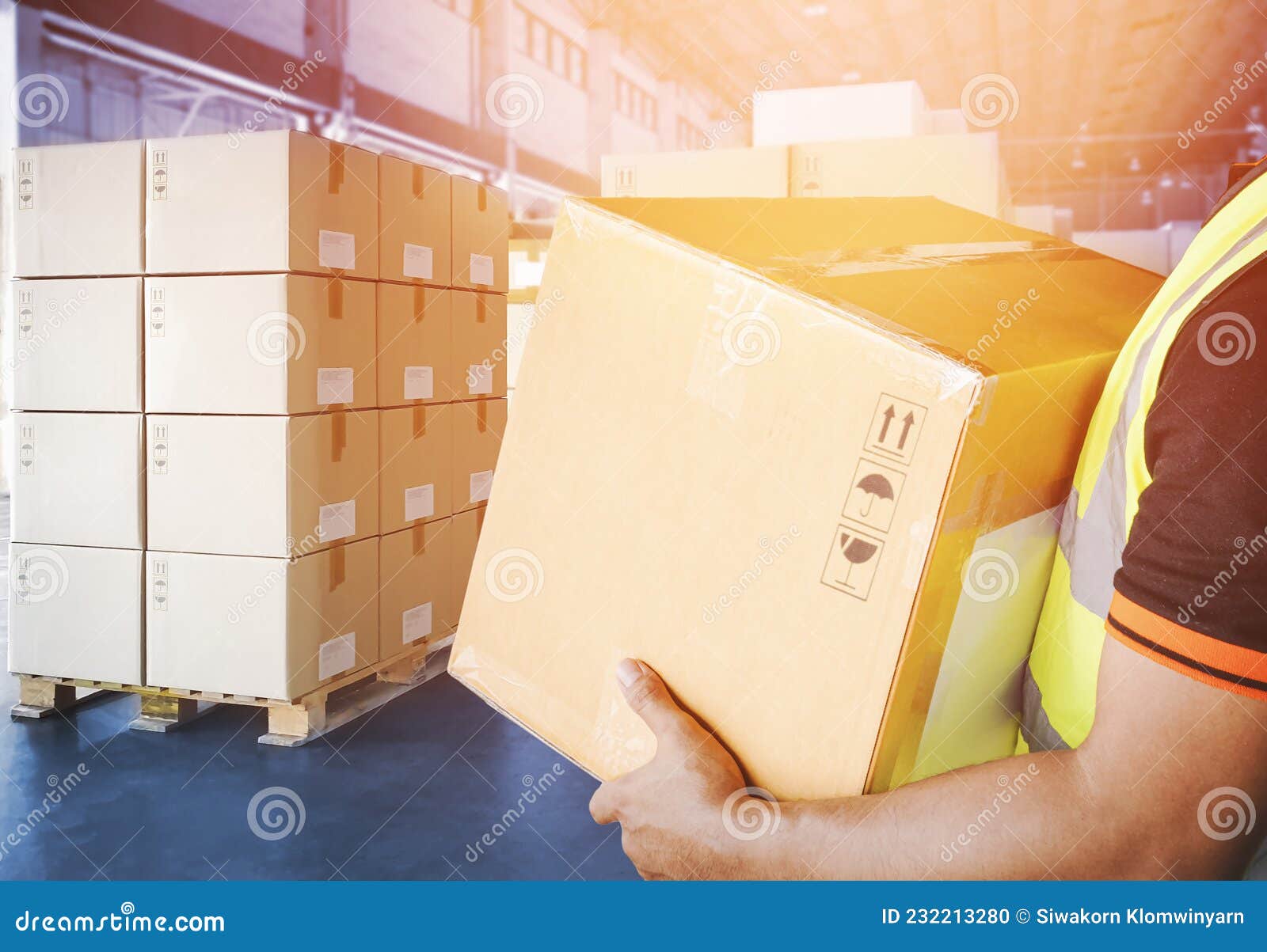 Worker Courier is Carrying Package Box at Storage Warehouse. Shipment ...