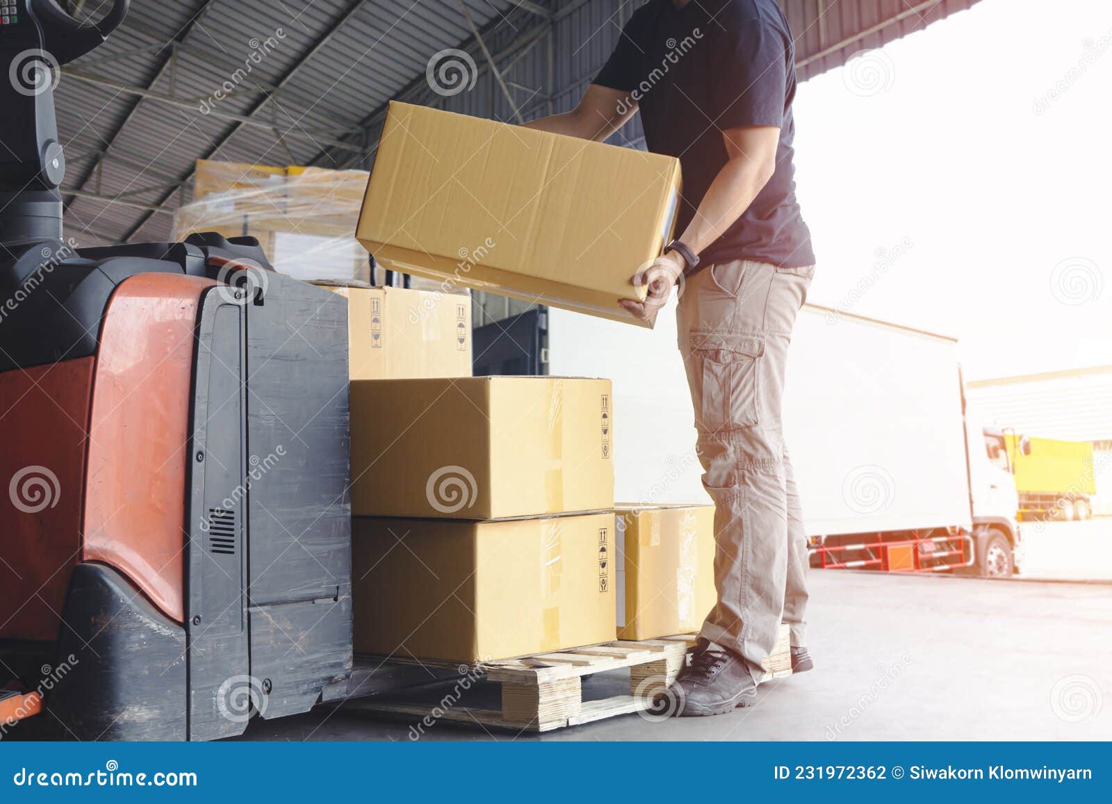 Worker Courier Lifting Package Boxes Stack on Pallet. Delivery ...
