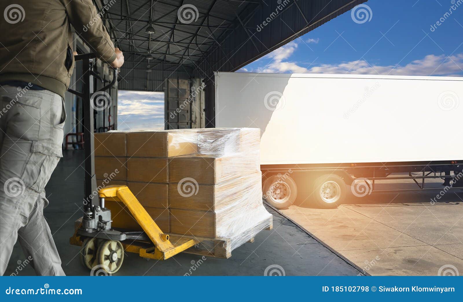 Worker Courier Unloading Cargo Pallet Shipment Goods Into A Truck Stock ...