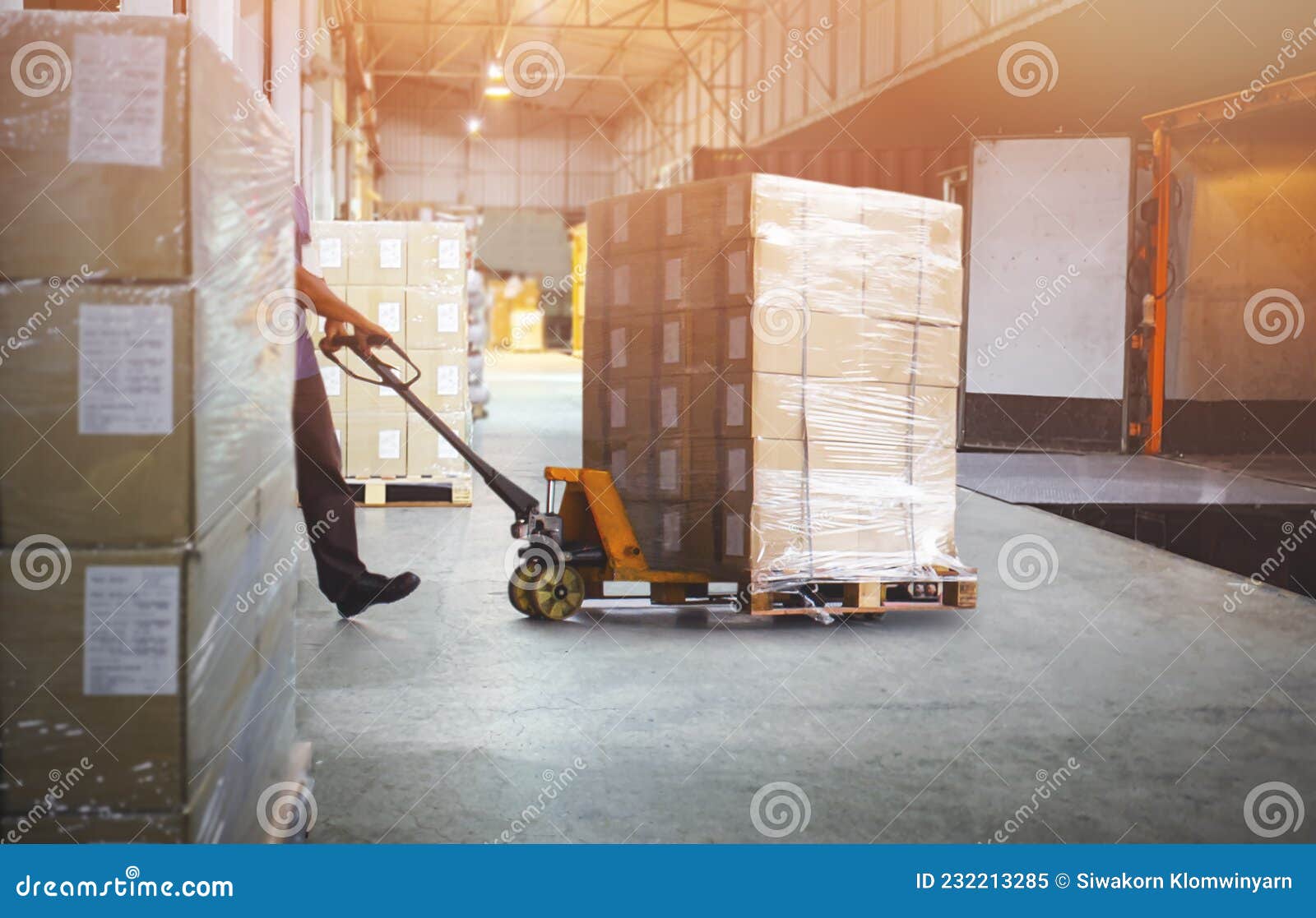 Worker Courier Unloading Package Box Out of Cargo Container. Delivery ...