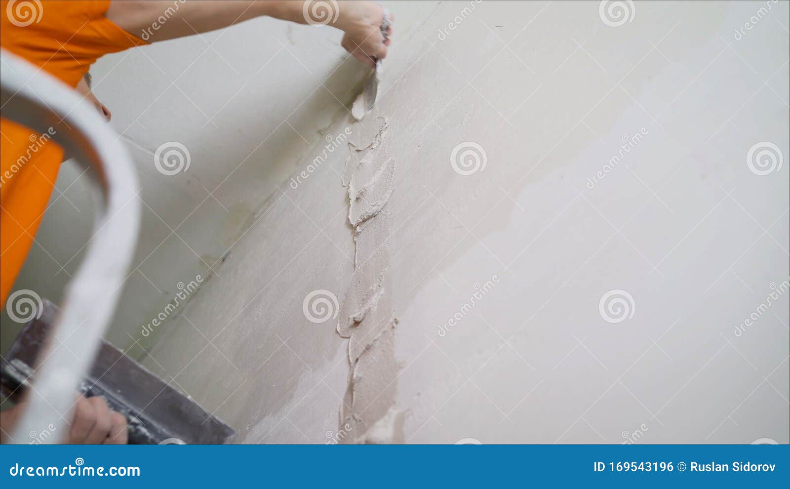 Plasterer Putting Plaster On Wall. Worker Covers The Wall With Mortar ...