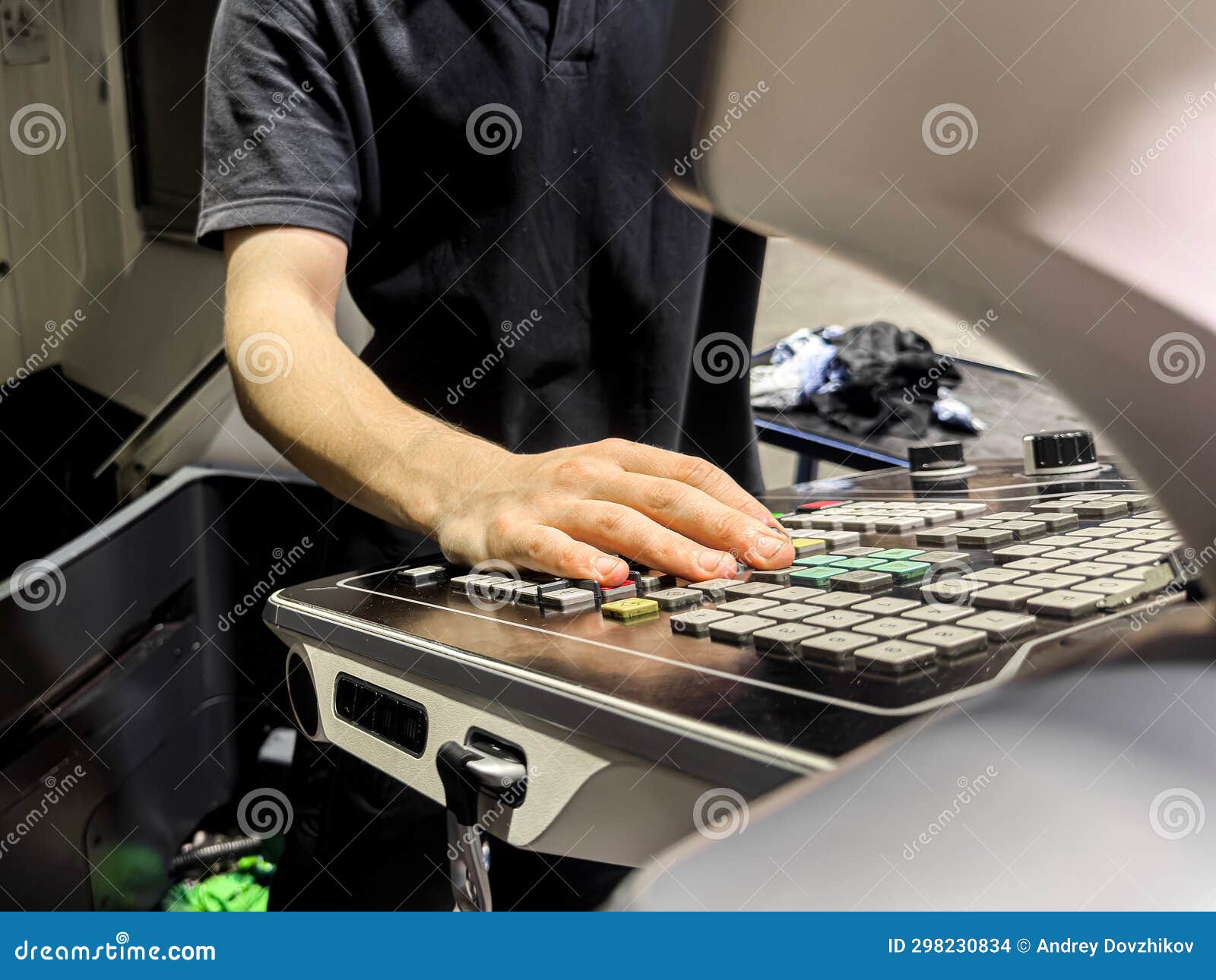 A Worker Examines the on-board Computer of a New CNC Milling Machine ...