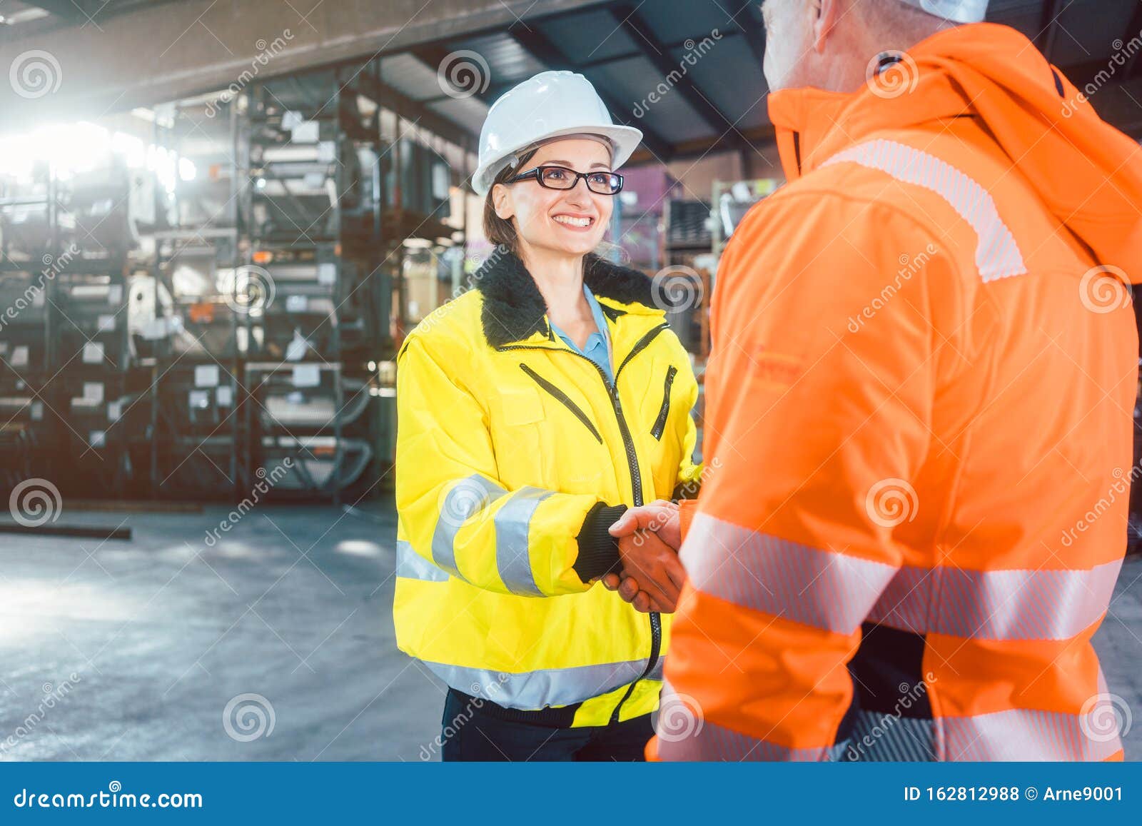 Worker and Customer in Warehouse Doing Handshake Stock Photo - Image of ...
