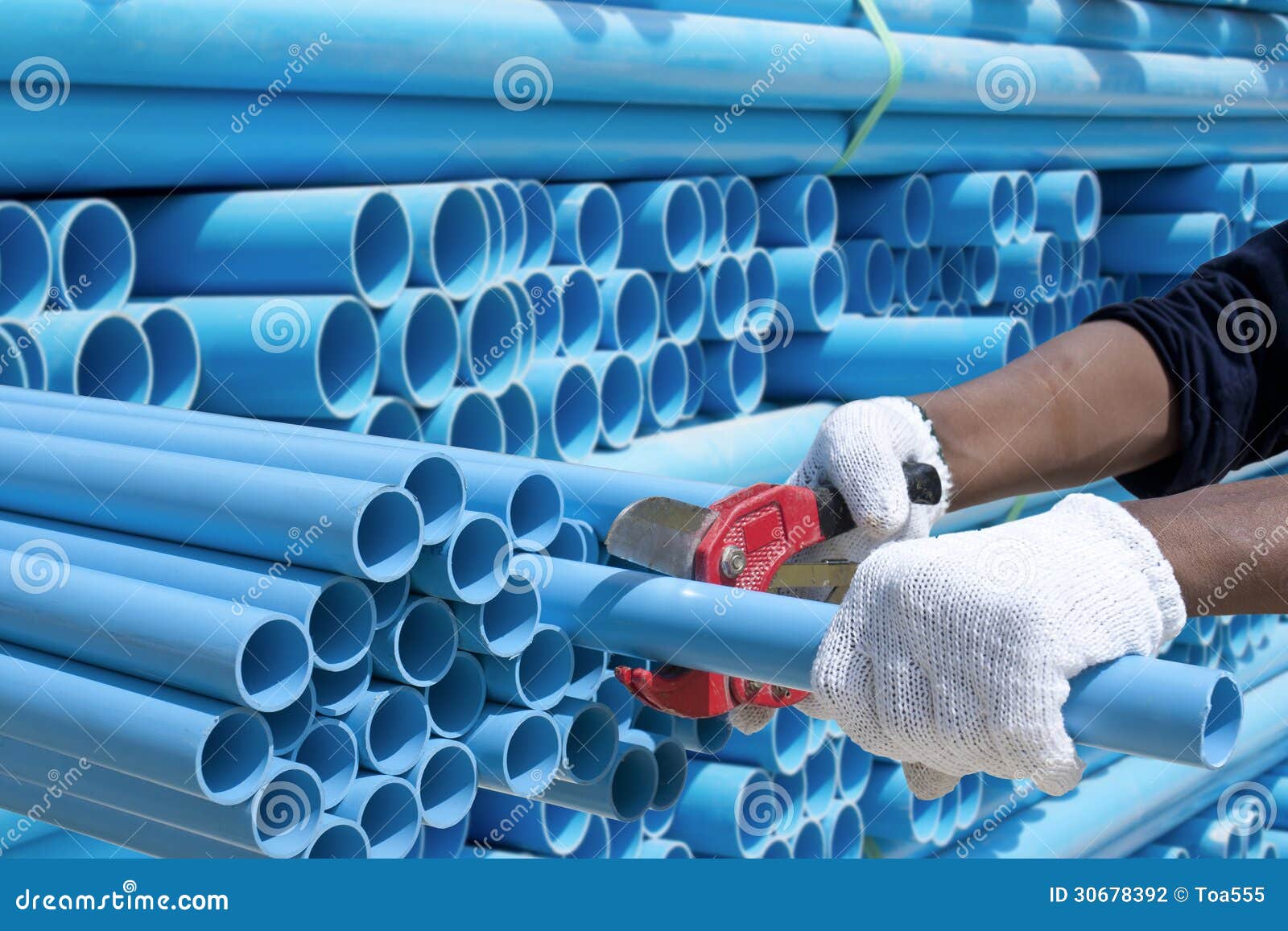 Worker cut pvc pipe stock photo. Image of service, equipment - 30678392