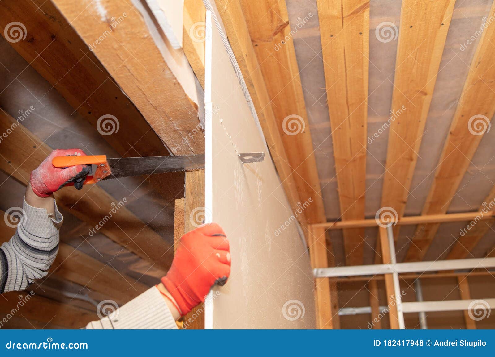 Drywall Construction, Attic Renovation. Man Fixing Drywall Suspended ...