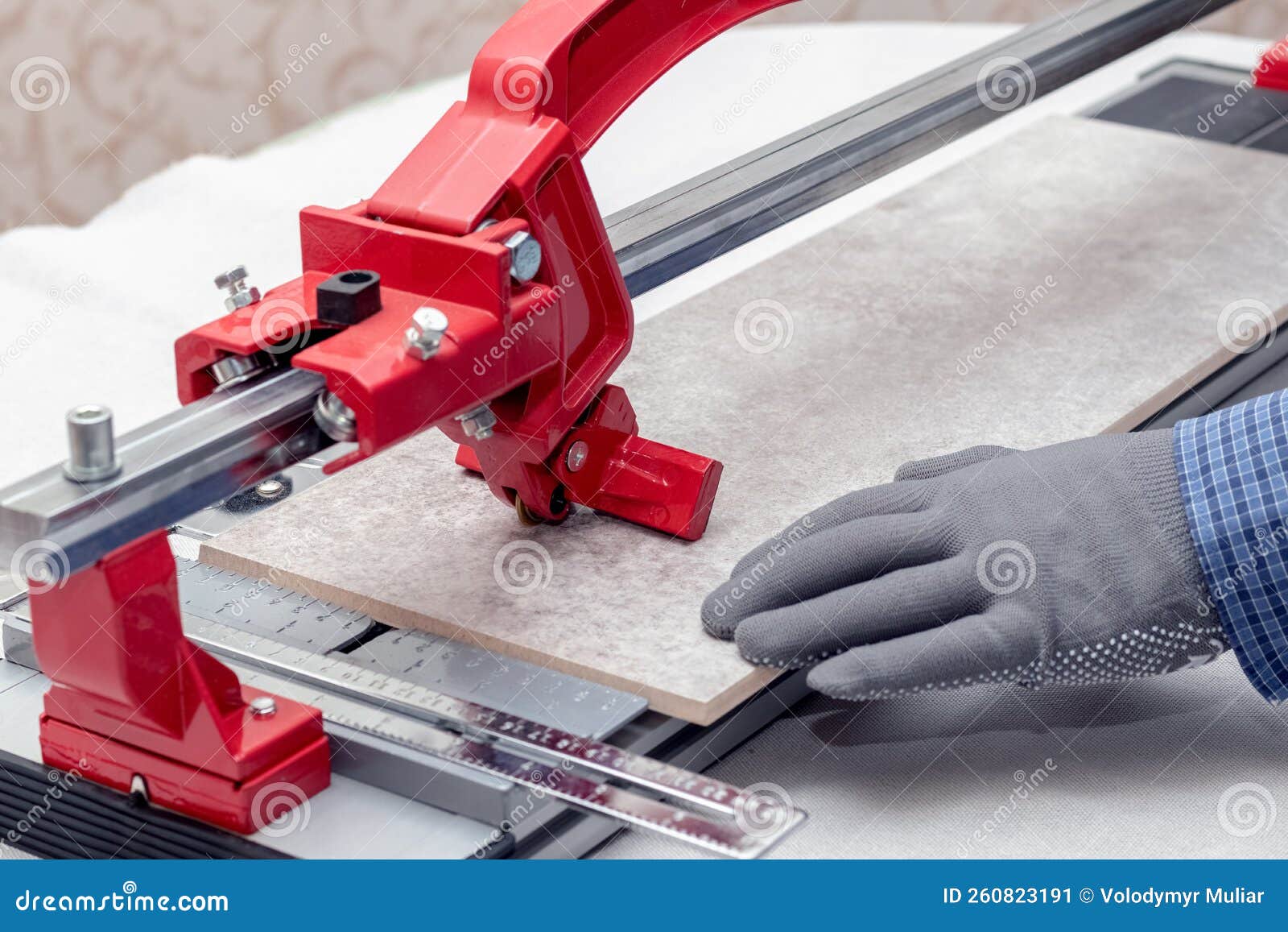 A Worker Cuts Facing Tiles with a Tile Cutter Stock Image - Image of ...