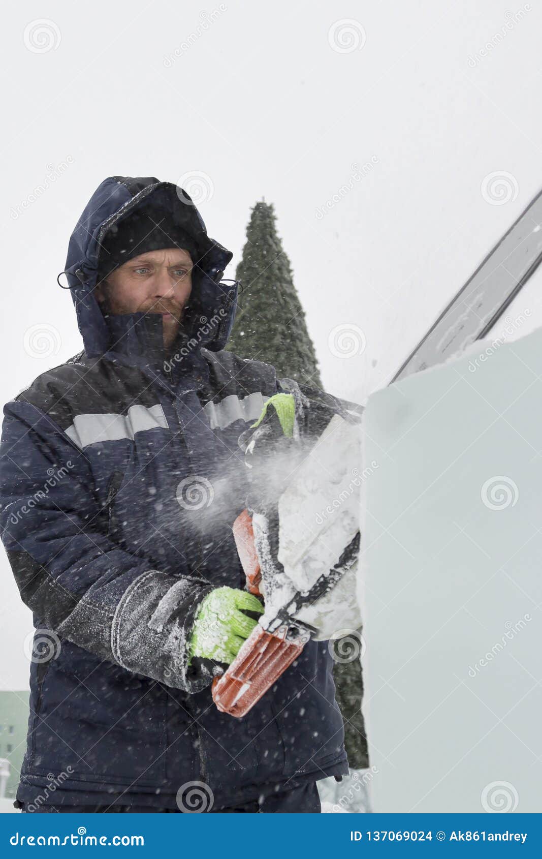 Worker Cuts a Lump of Ice with a Chainsaw Stock Photo - Image of colors ...