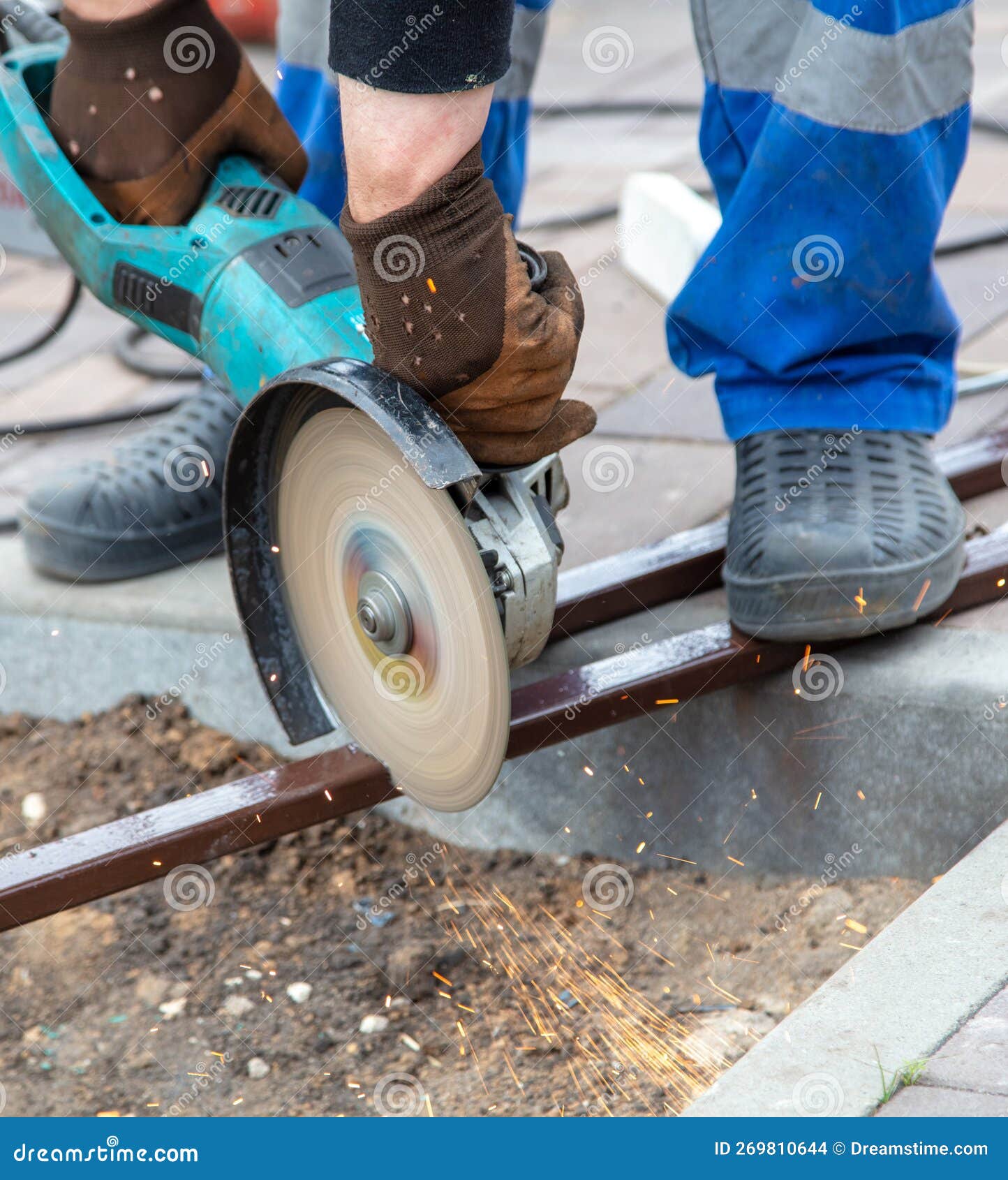 A Worker Cuts Metal at a Construction Site. Stock Photo - Image of ...