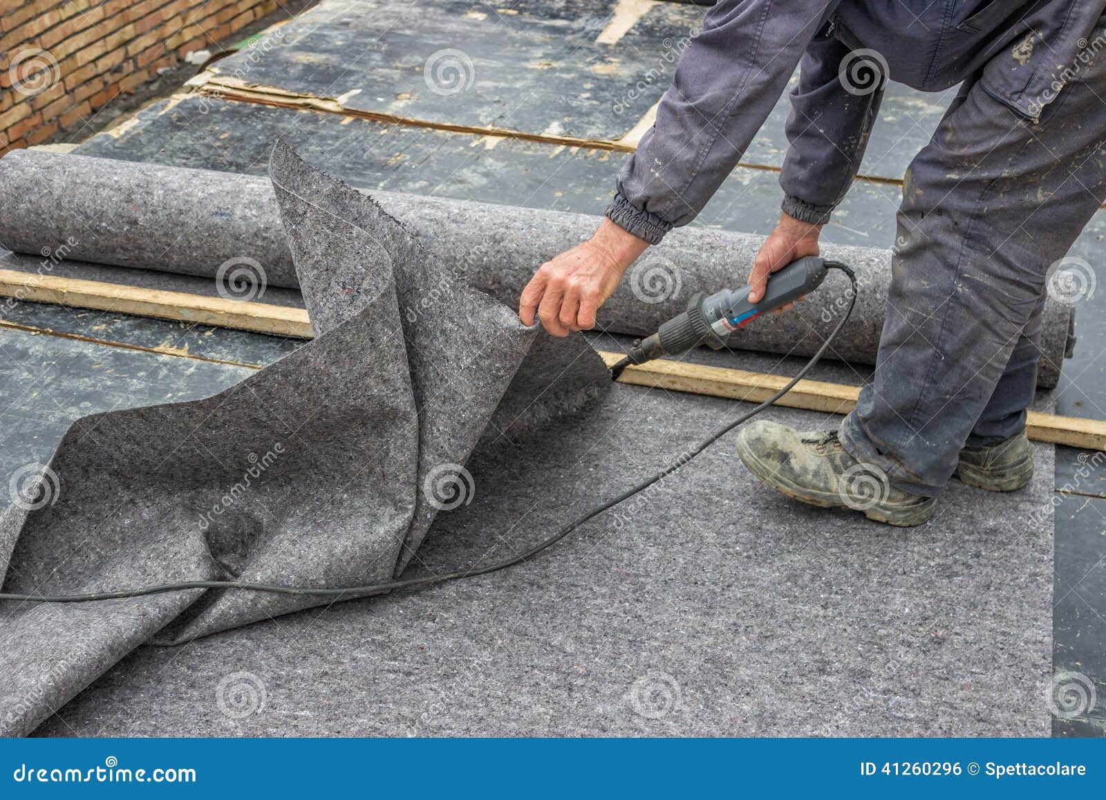 Worker Cutting Insulation Material for Basement Wall Stock Photo ...