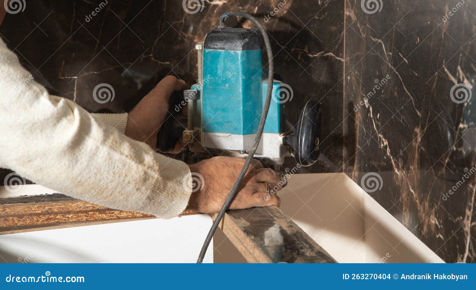 Worker Cutting Kitchen Countertop Using Electric Saw Stock Photo ...