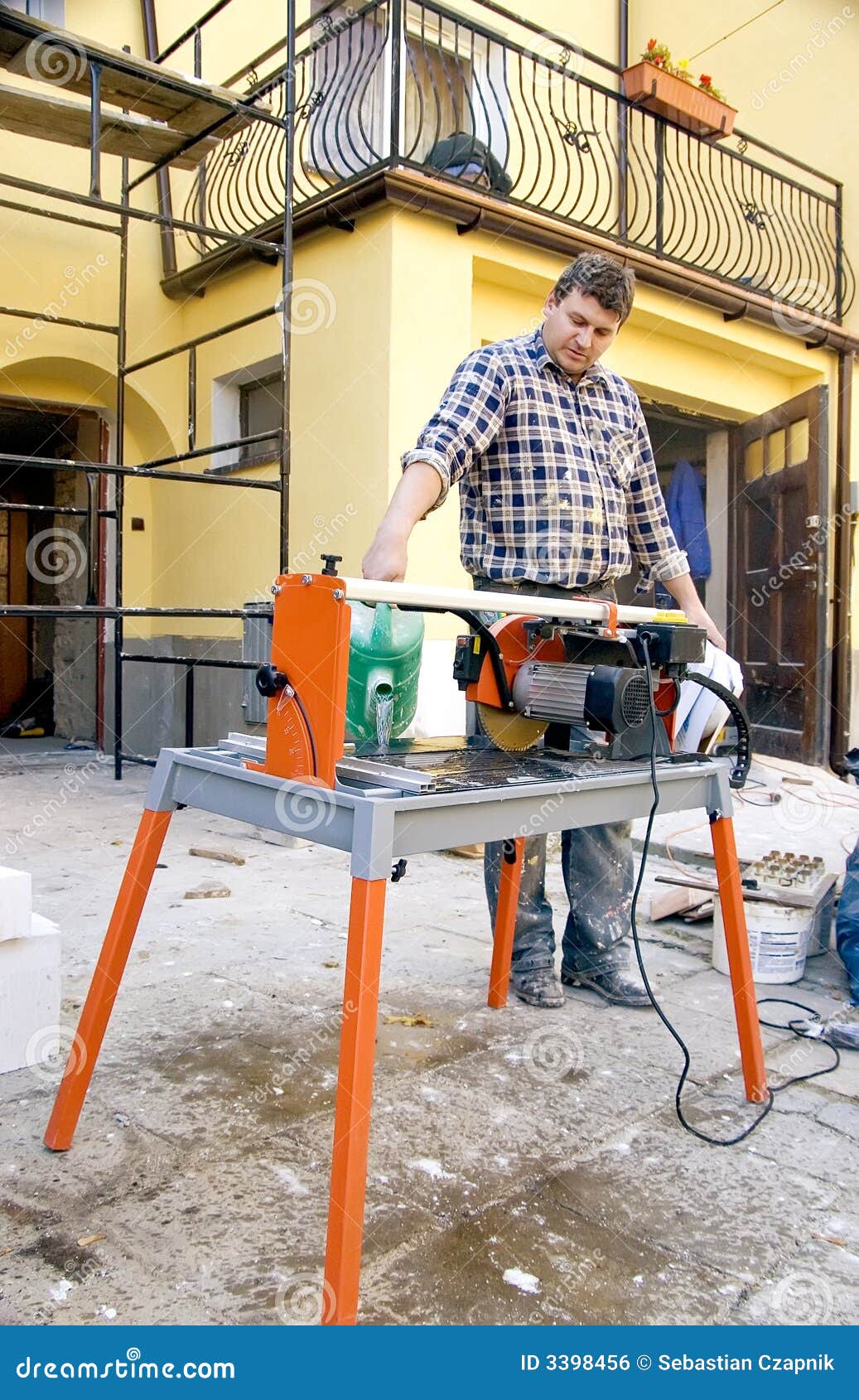 Worker and cutting machine stock photo. Image of improvement - 3398456