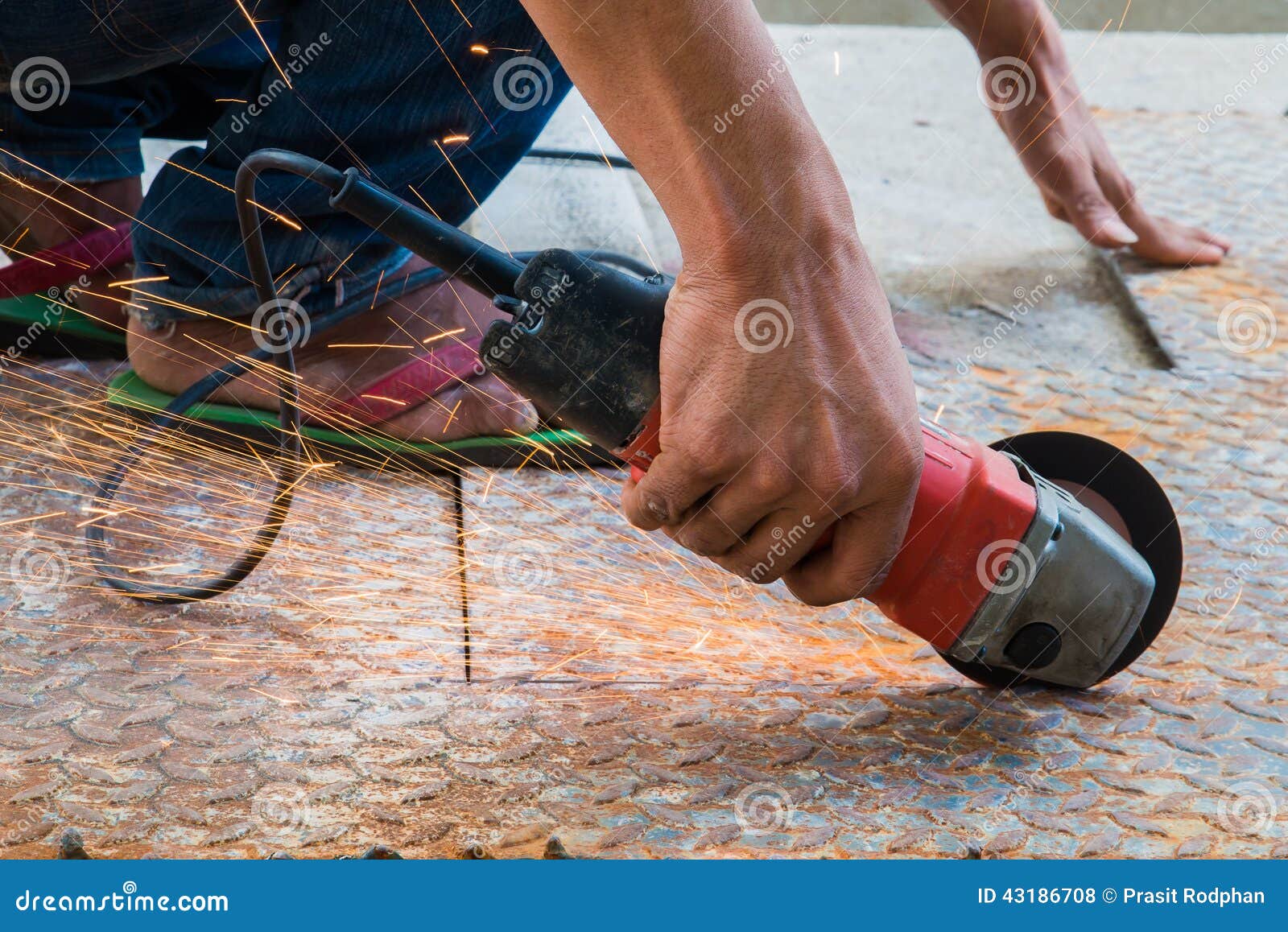 Worker Cutting Metal with Grinder. Sparks while Grinding Iron Stock ...