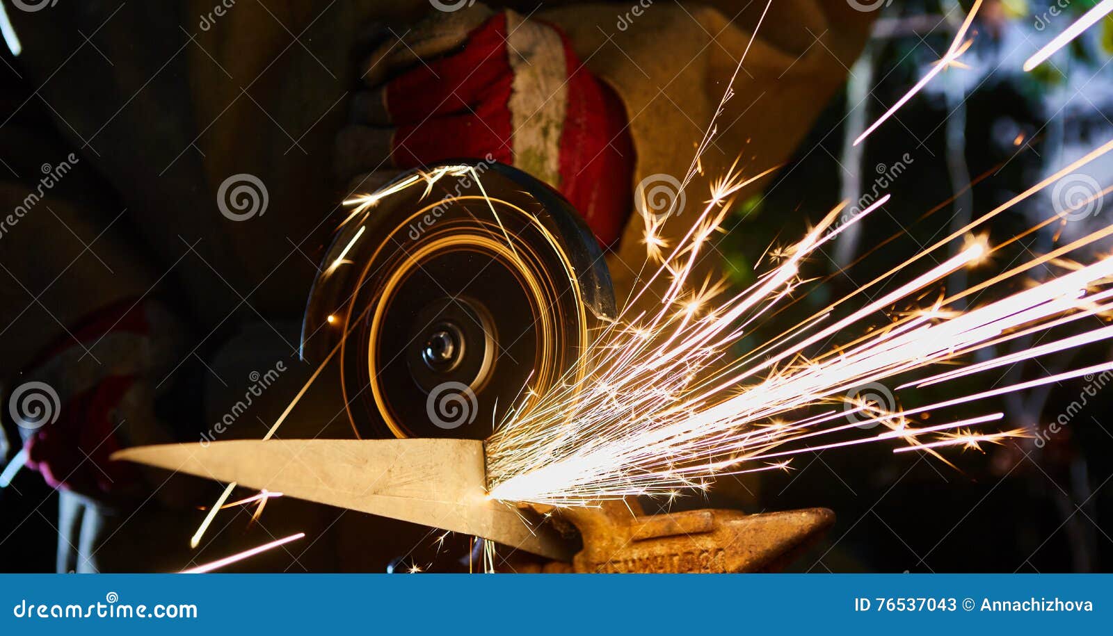 Worker Cutting Metal with Grinder. Sparks while Grinding Iron Stock ...