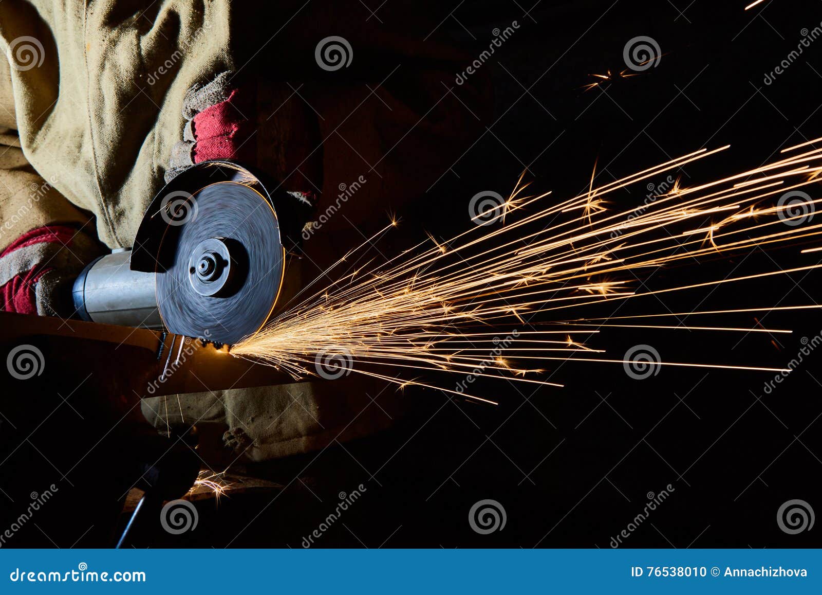 Worker Cutting Metal with Grinder. Sparks while Grinding Iron Stock ...