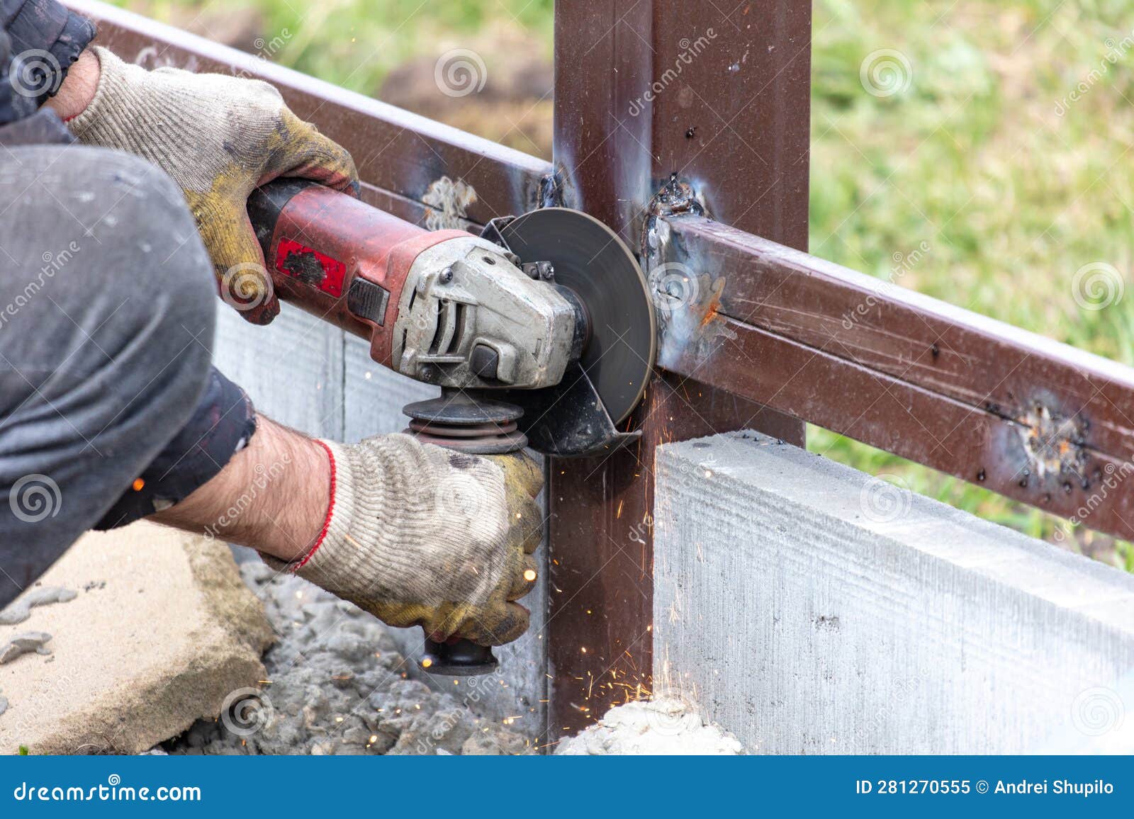 A Worker is Cutting Metal To Install a Fence Stock Image - Image of ...