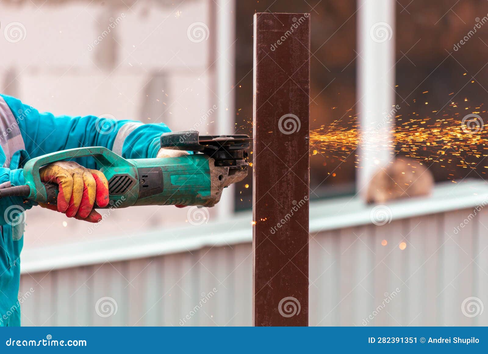 A Worker is Cutting Metal To Install a Fence Stock Image - Image of ...