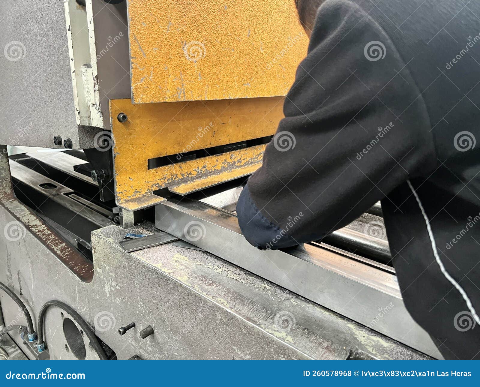 Worker Cutting Sheet Metal on a Sheet Metal Cutting Guillotine Stock ...