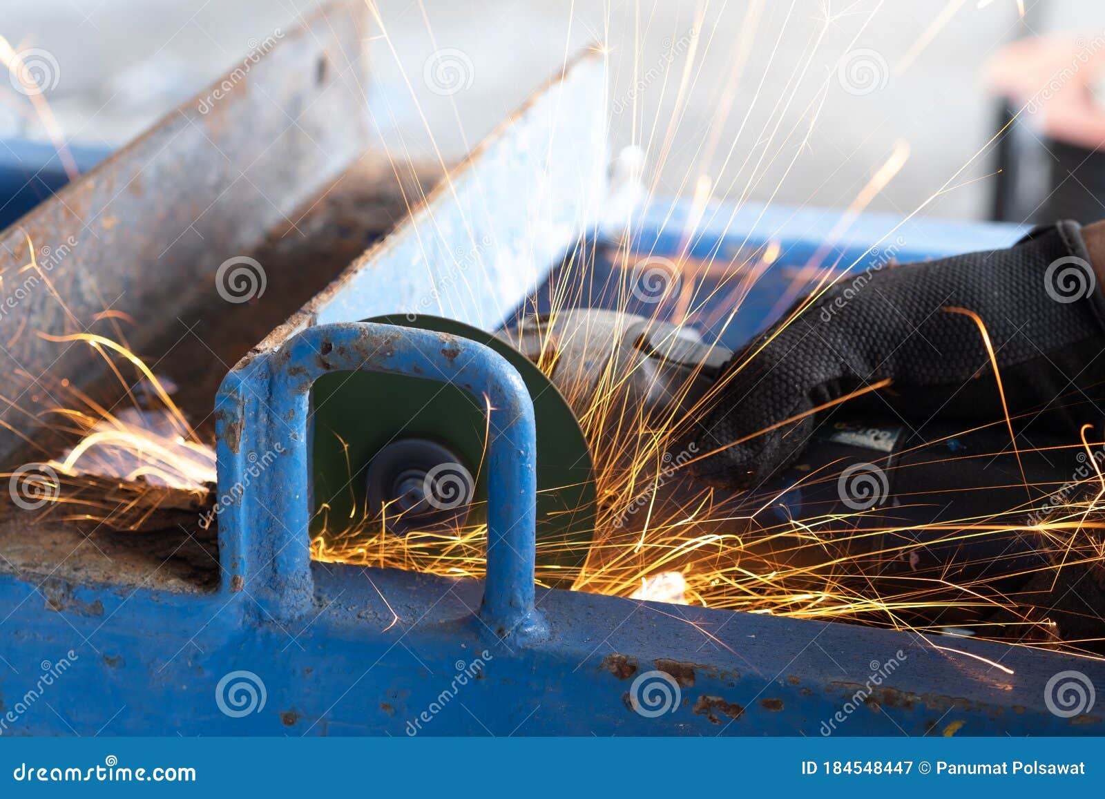 Worker Cutting Steel with Grinding Machine and Splashes of Sparks in ...