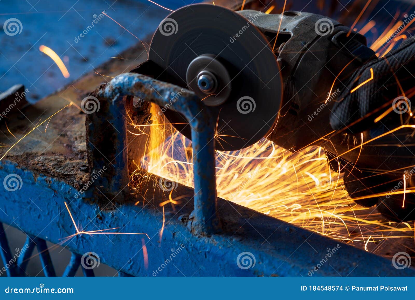Worker Cutting Steel with Grinding Machine and Splashes of Sparks in ...