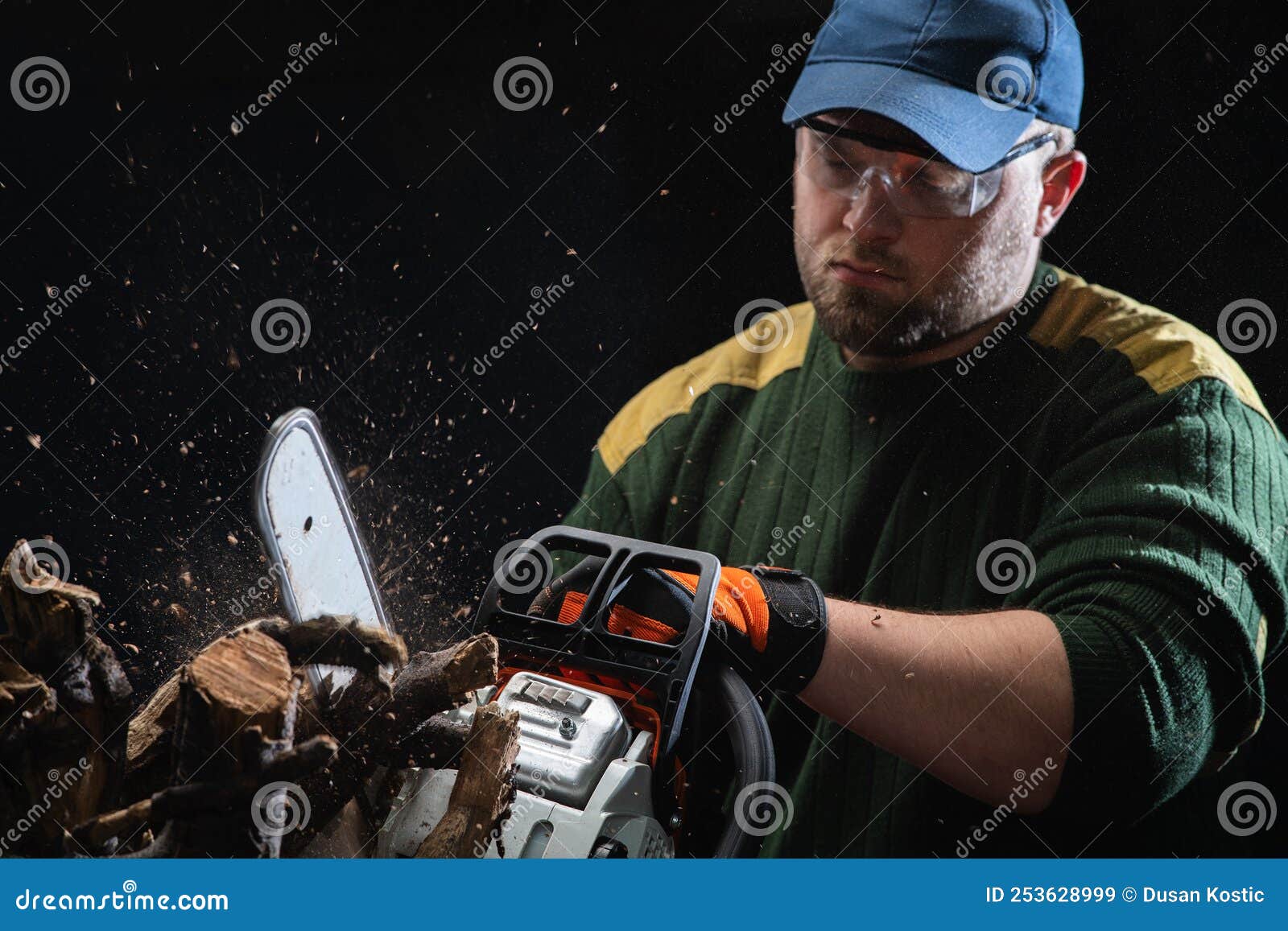 The Worker Cutting the Tree with a Chainsaw Stock Image - Image of ...