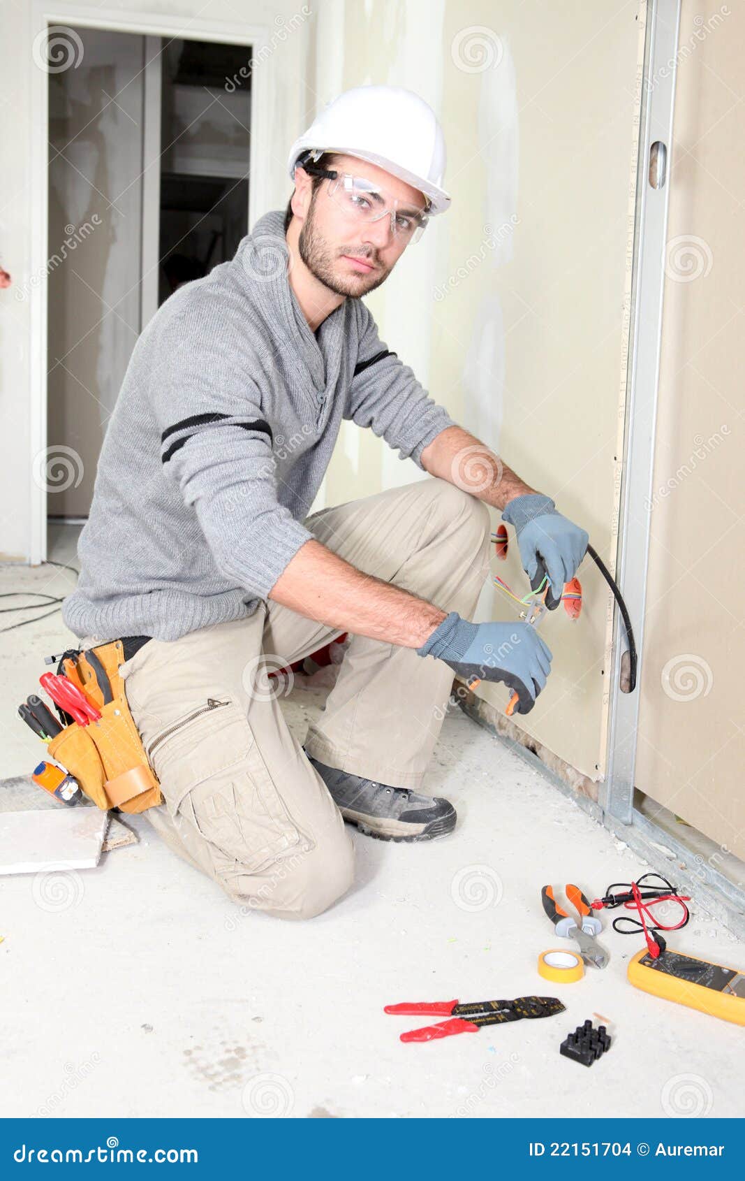 Worker cutting a wire stock photo. Image of cutters, kneel - 22151704