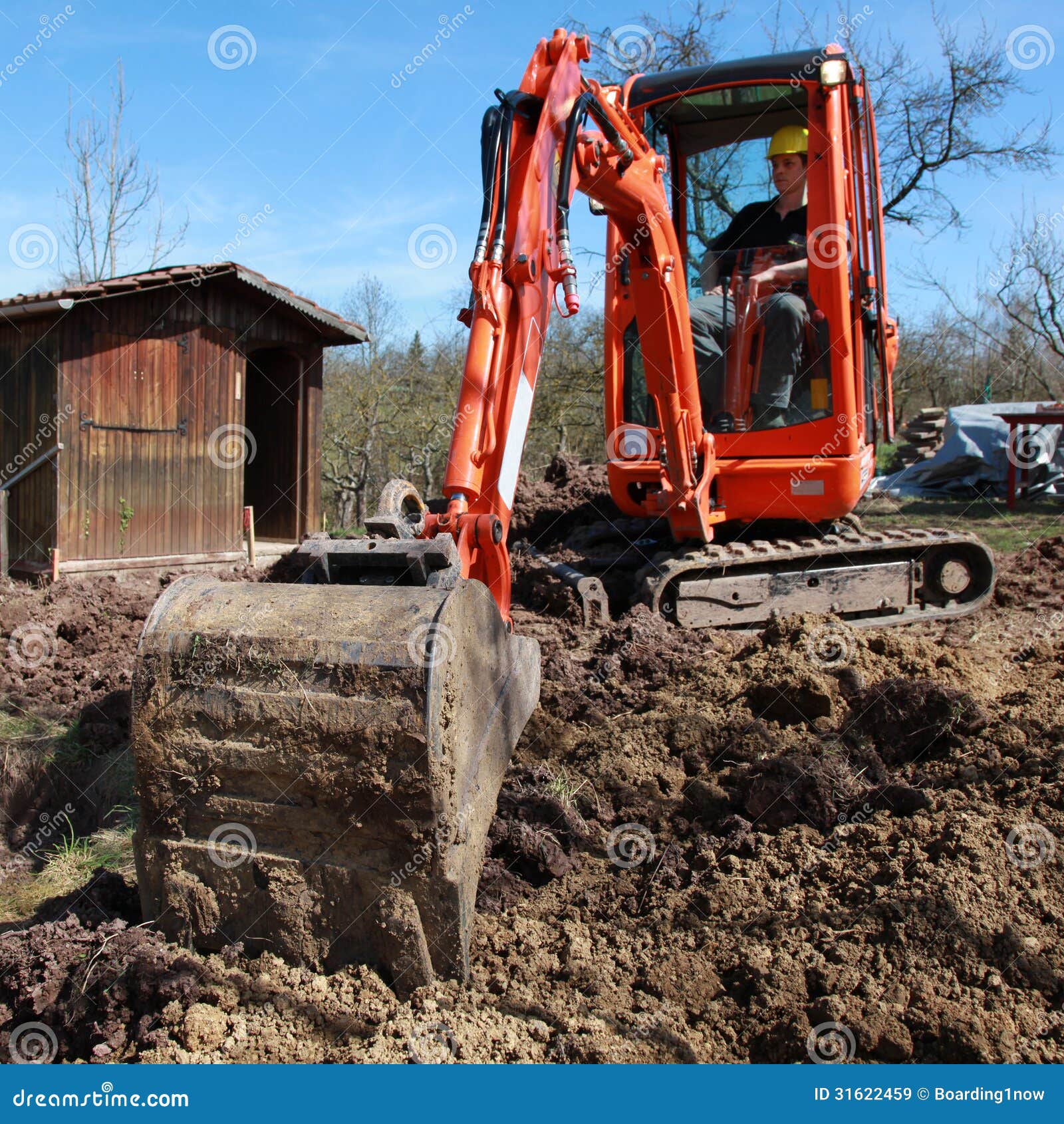 Worker digging in the dirt stock image. Image of construction - 31622459