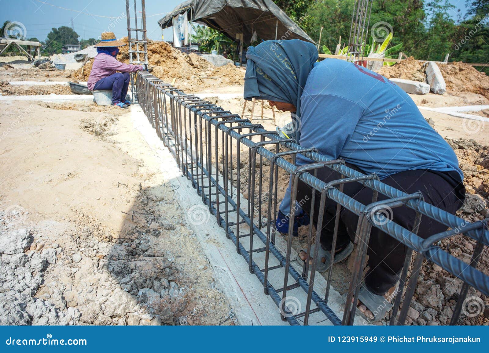 Worker Doing the Steelwork for Reinforcement of the Concrete Structure ...
