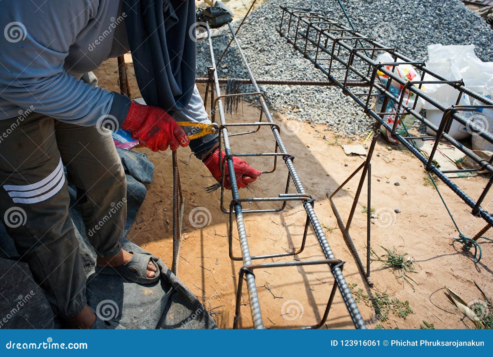 Worker Doing the Steelwork for Reinforcement of the Concrete Structure ...