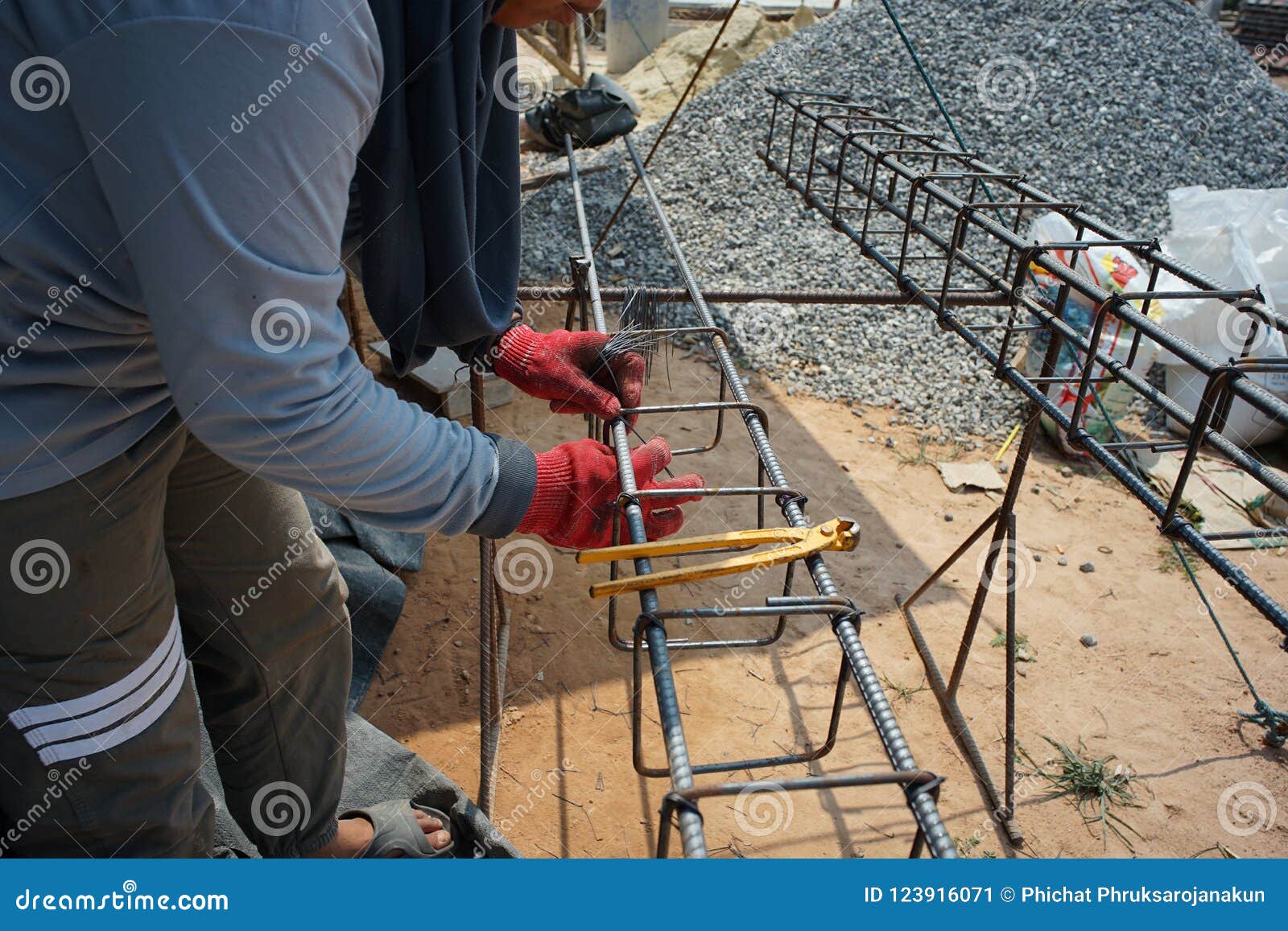 Worker Doing the Steelwork for Reinforcement of the Concrete Structure ...