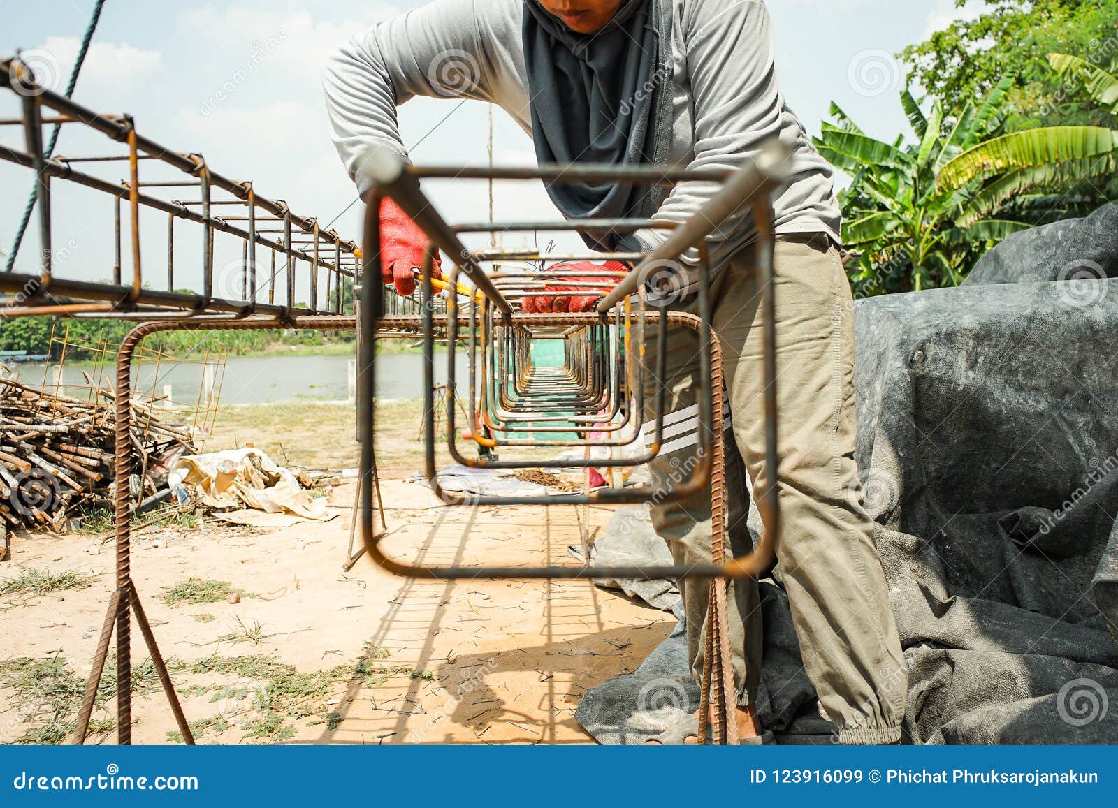 Worker Doing the Steelwork for Reinforcement of the Concrete Structure ...