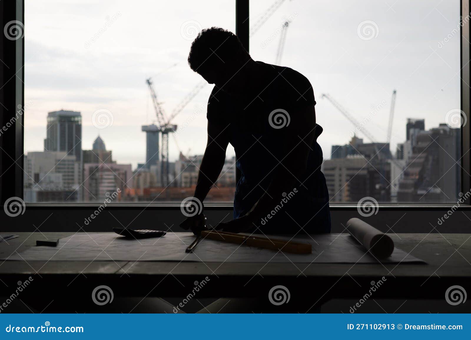 Worker with Drawing on Blueprint of Architectural Project Plan on ...