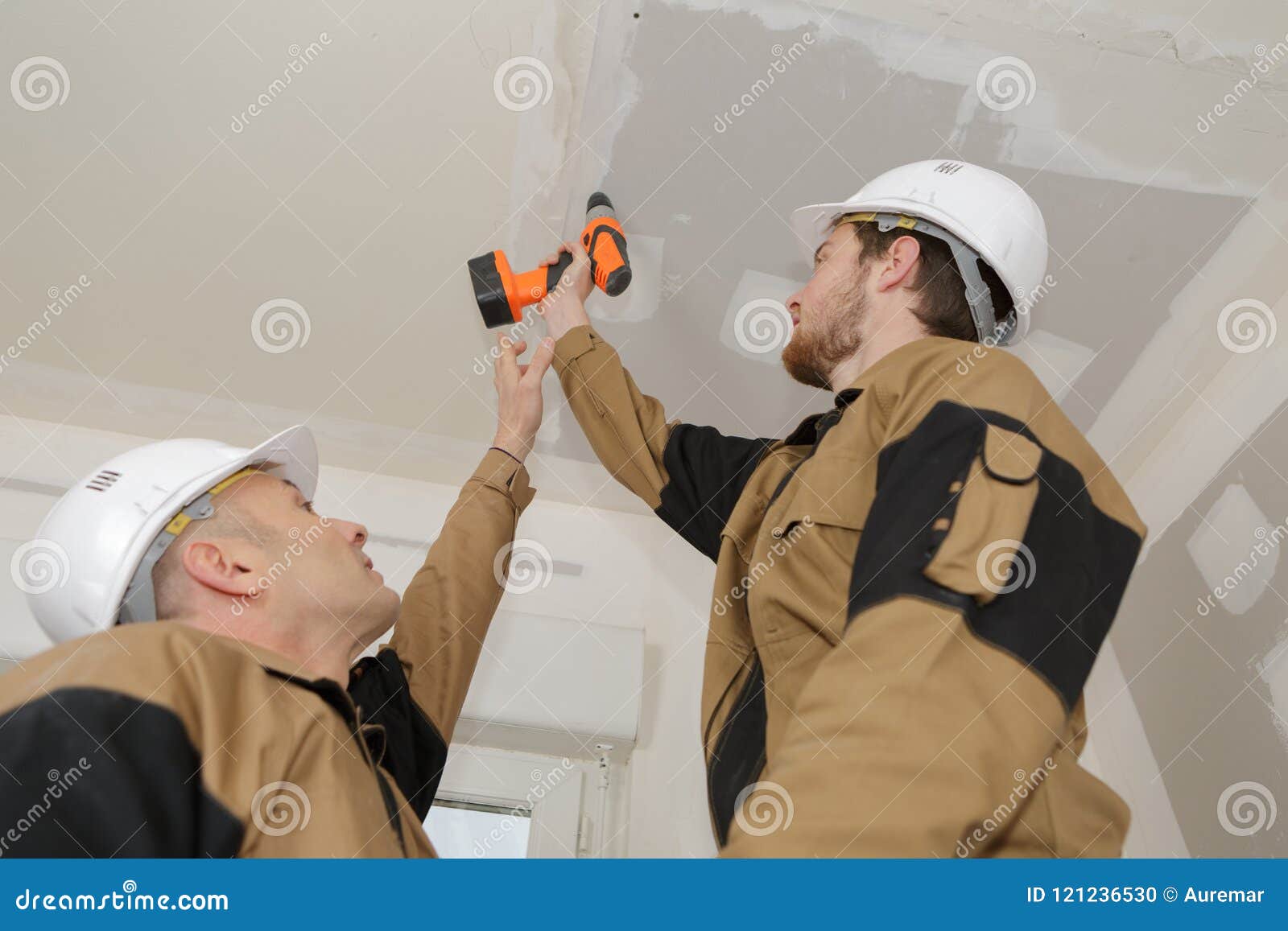 Worker Drilling the Ceiling Stock Photo - Image of line, safety: 121236530