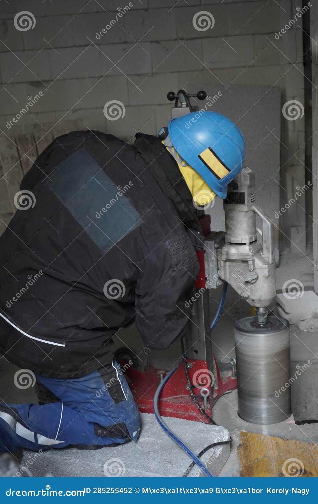 A Worker Drills a Concrete Main Deme with a Huge Core Drill Stock Photo ...