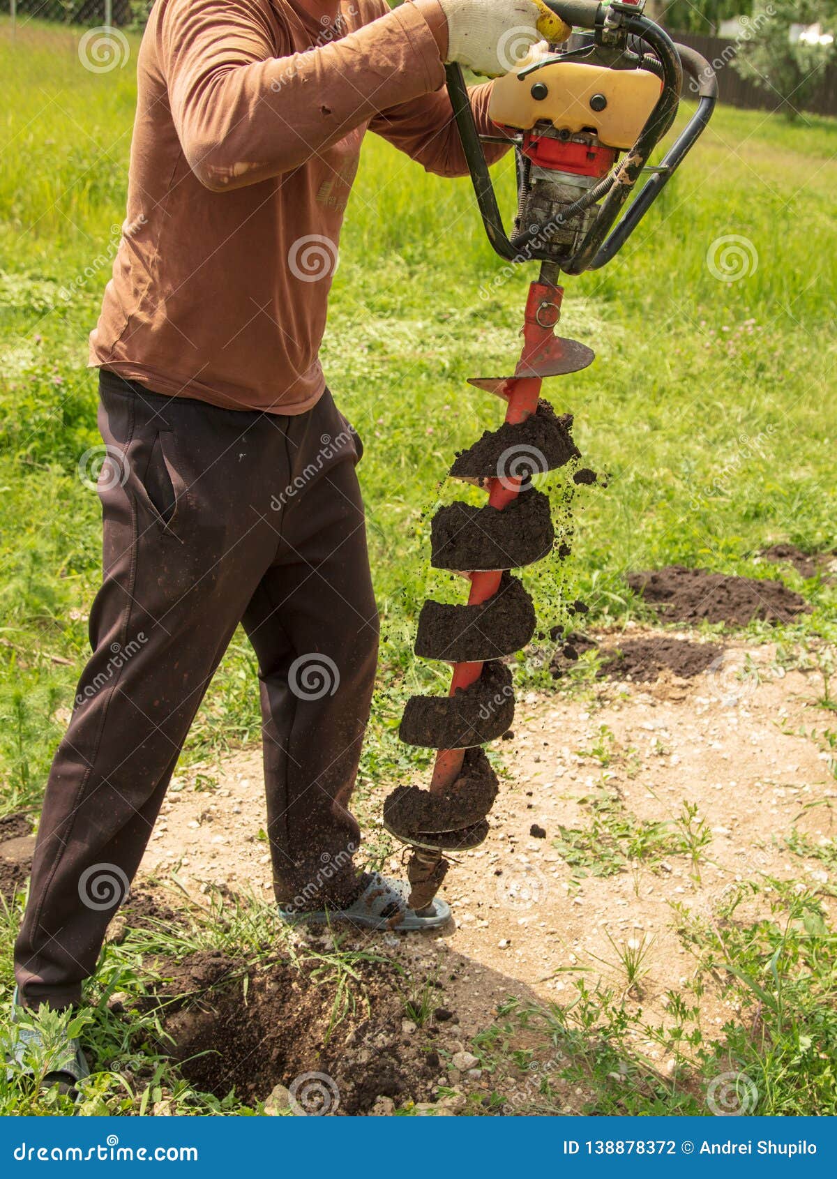 Worker Drills the Ground at the Construction Site Stock Photo - Image ...