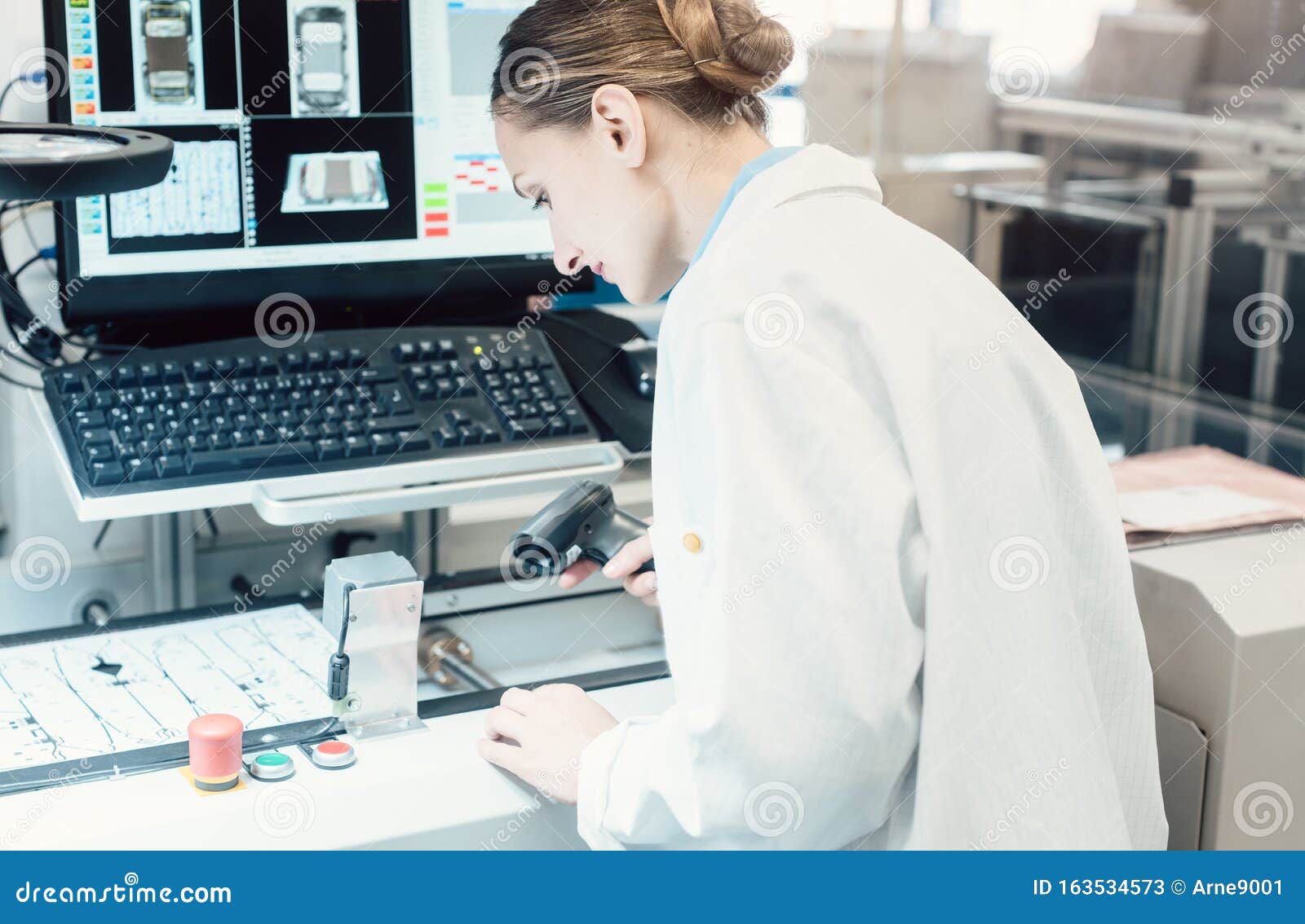 Worker in Electronics Factory Scanning Code for Optical Inspection ...