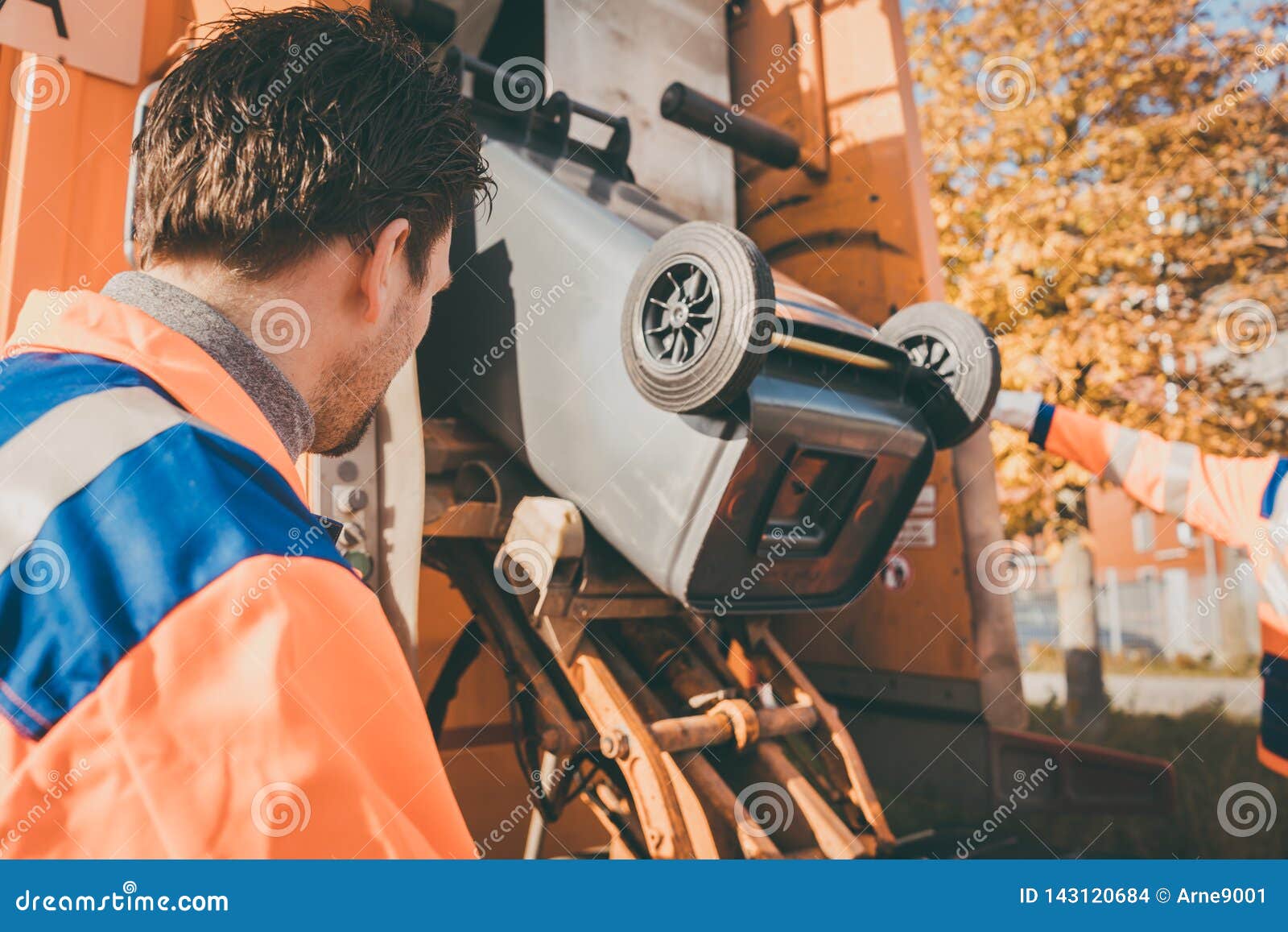 Dustman Worker Is Moving Empty Garbage Container From Truck Royalty ...