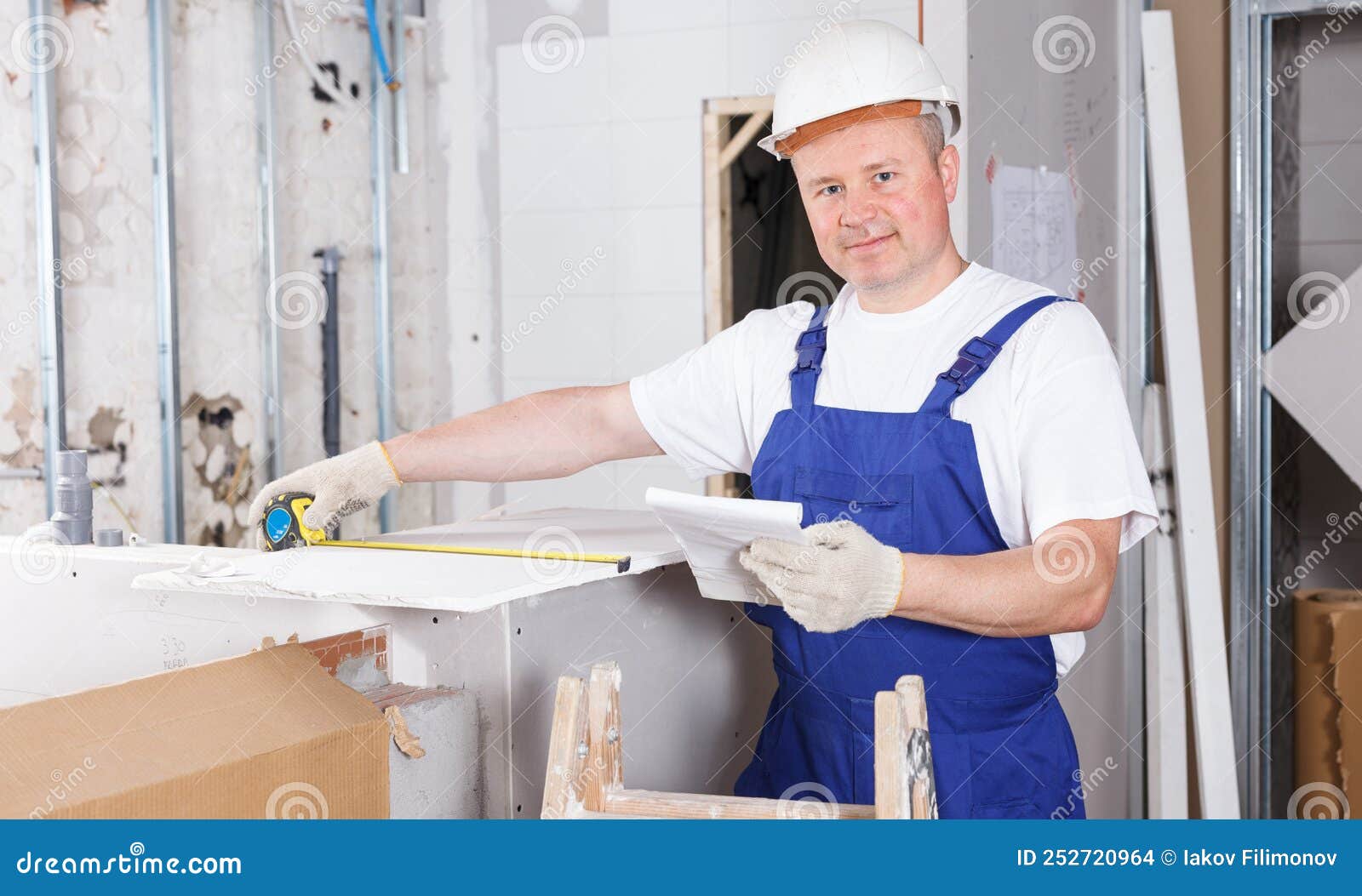 Worker Engaged in Drywall Mounting Stock Photo - Image of overhauls ...