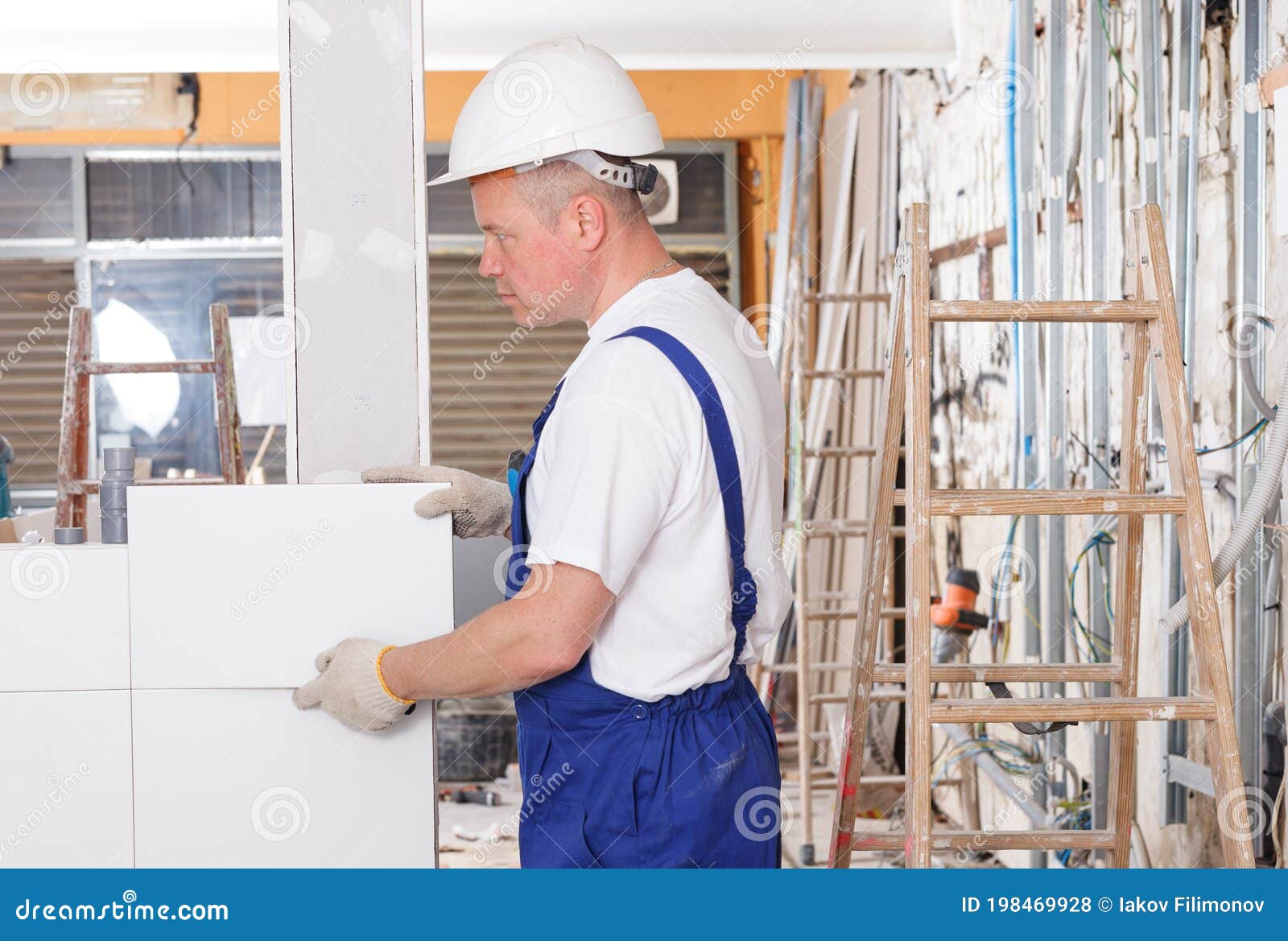 Worker Engaged in Wall Tiling Work Stock Photo - Image of dividing ...