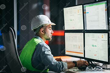 Worker Engineer Control Process of Production Uses Computer with Modern ...