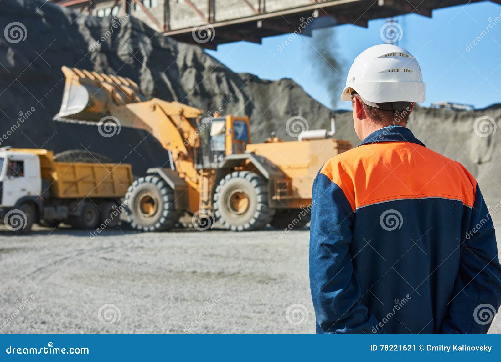 Worker Engineer Looks on Wheel Loader Loading Truck Stock Image - Image ...
