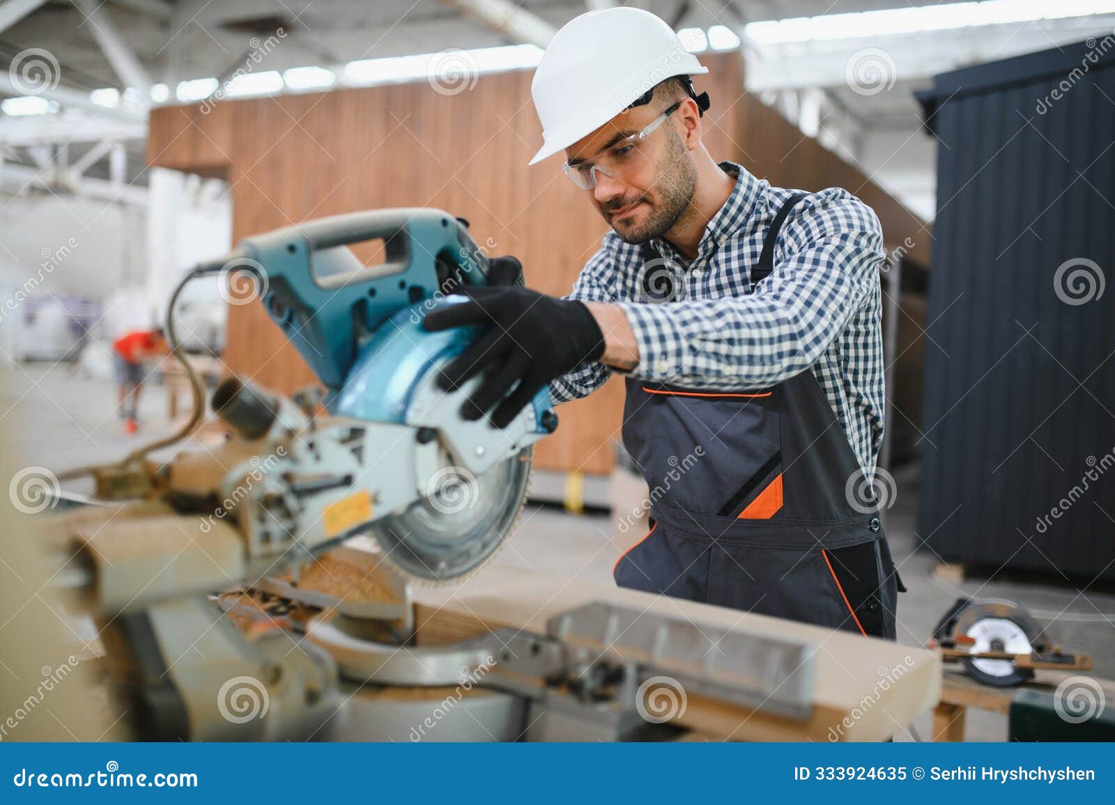 A Worker or Engineer in a Uniform Works on a Construction Site for the ...