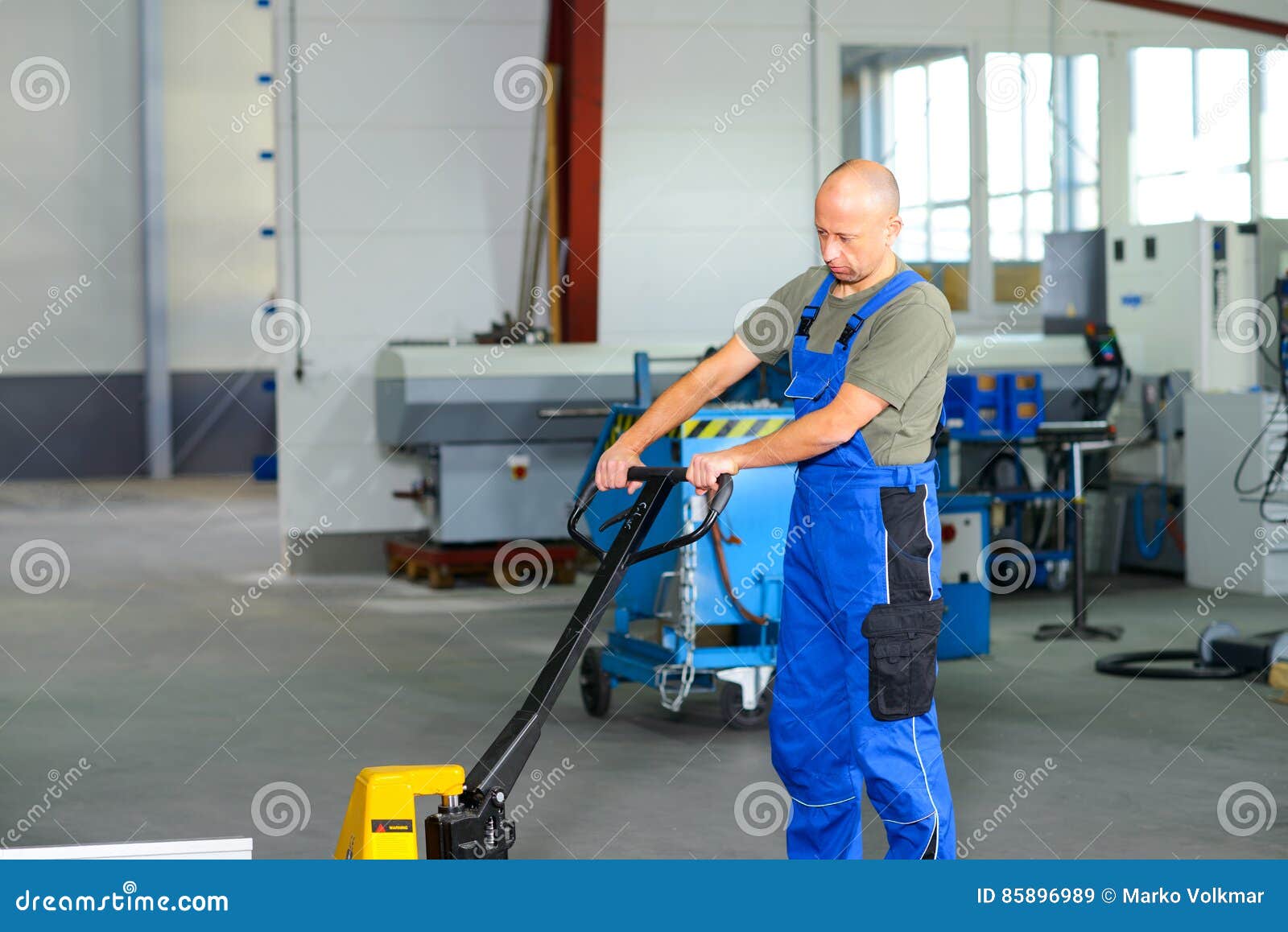 Worker in Factory with Hand Lift Stock Image - Image of pallet, machine ...
